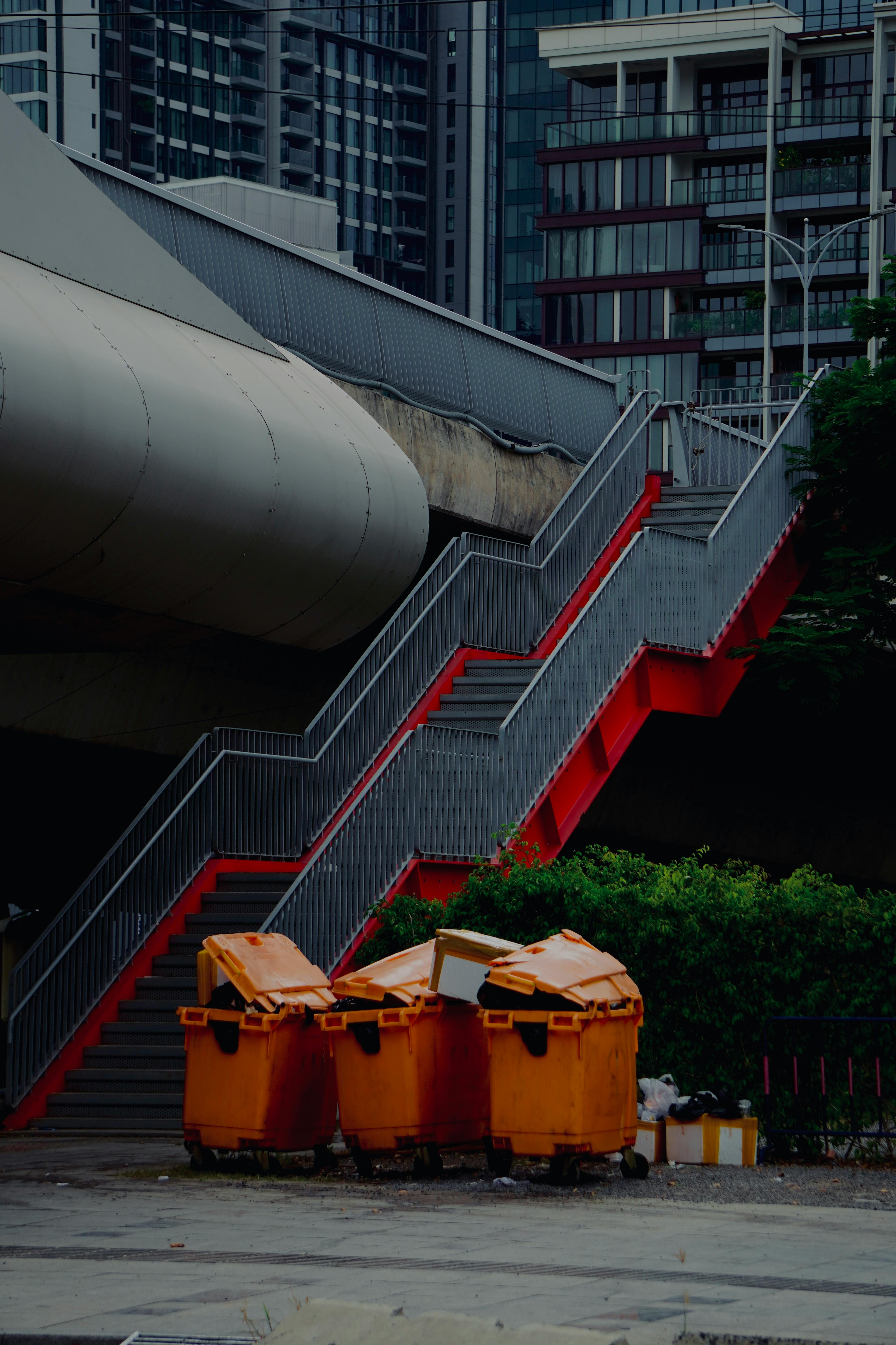 Urban Staircase with Orange Trash Bins · Free Stock Photo