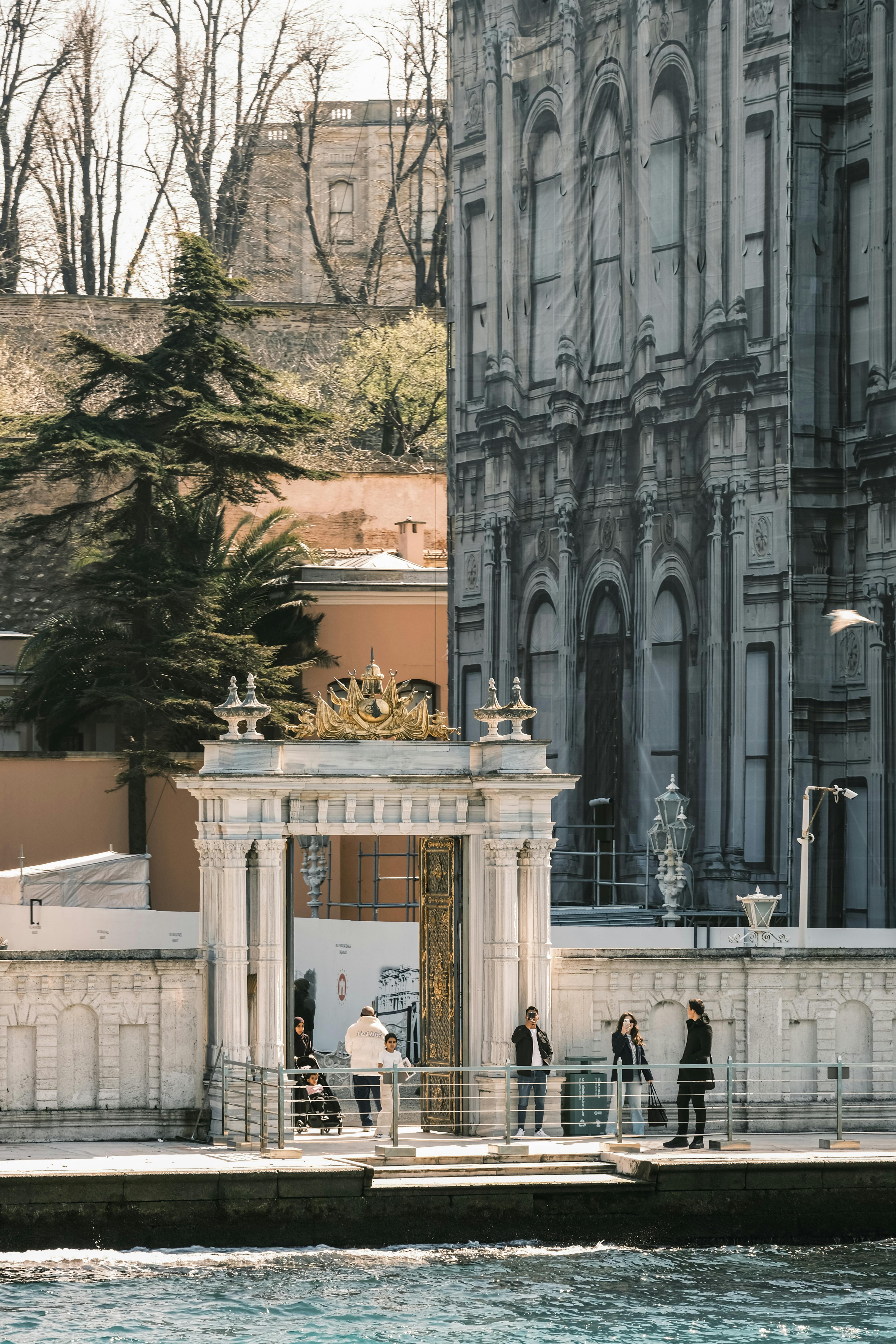 Ornate Waterfront Gate with Historic Architecture · Free Stock Photo