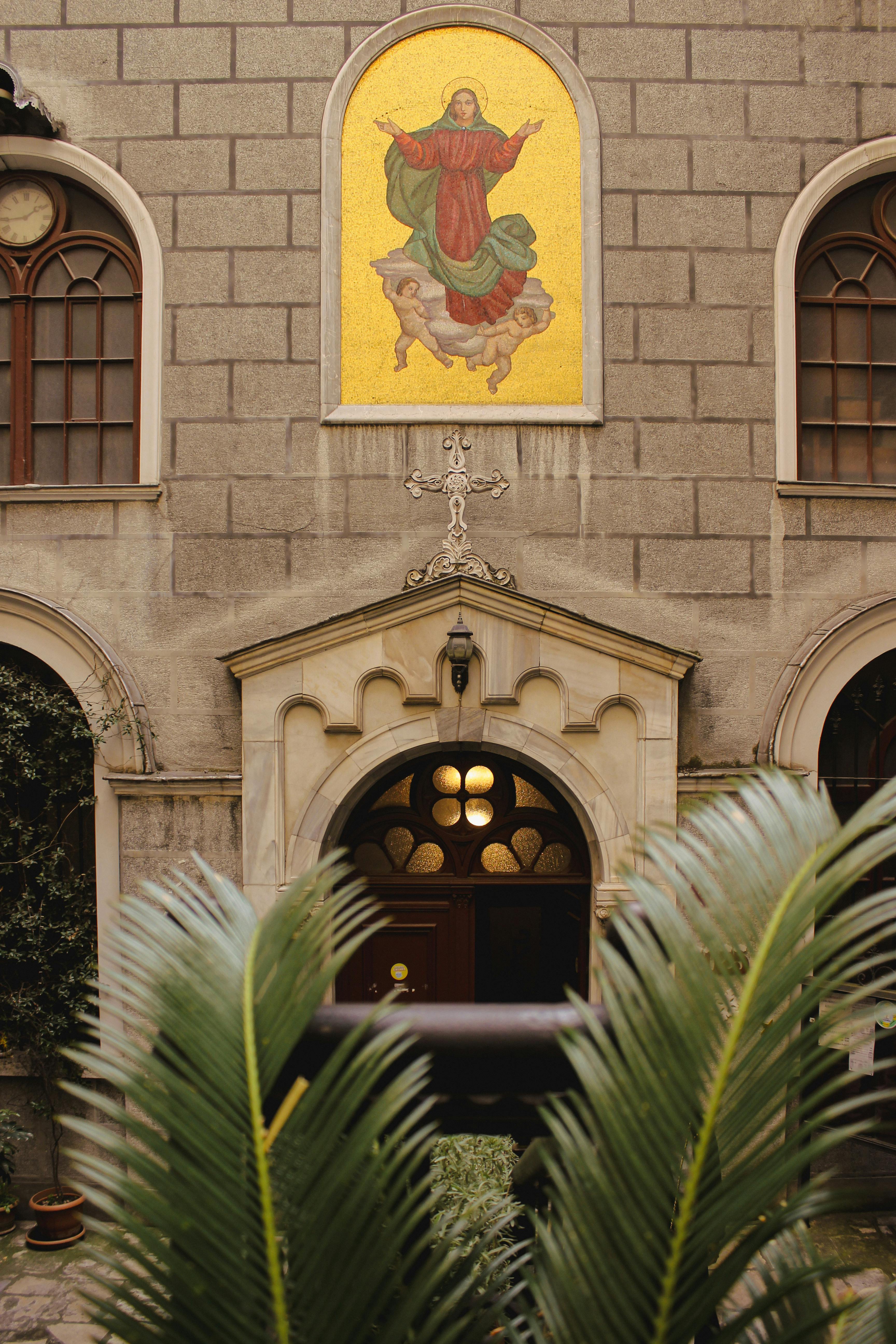 Historic Church Facade with Religious Iconography · Free Stock Photo