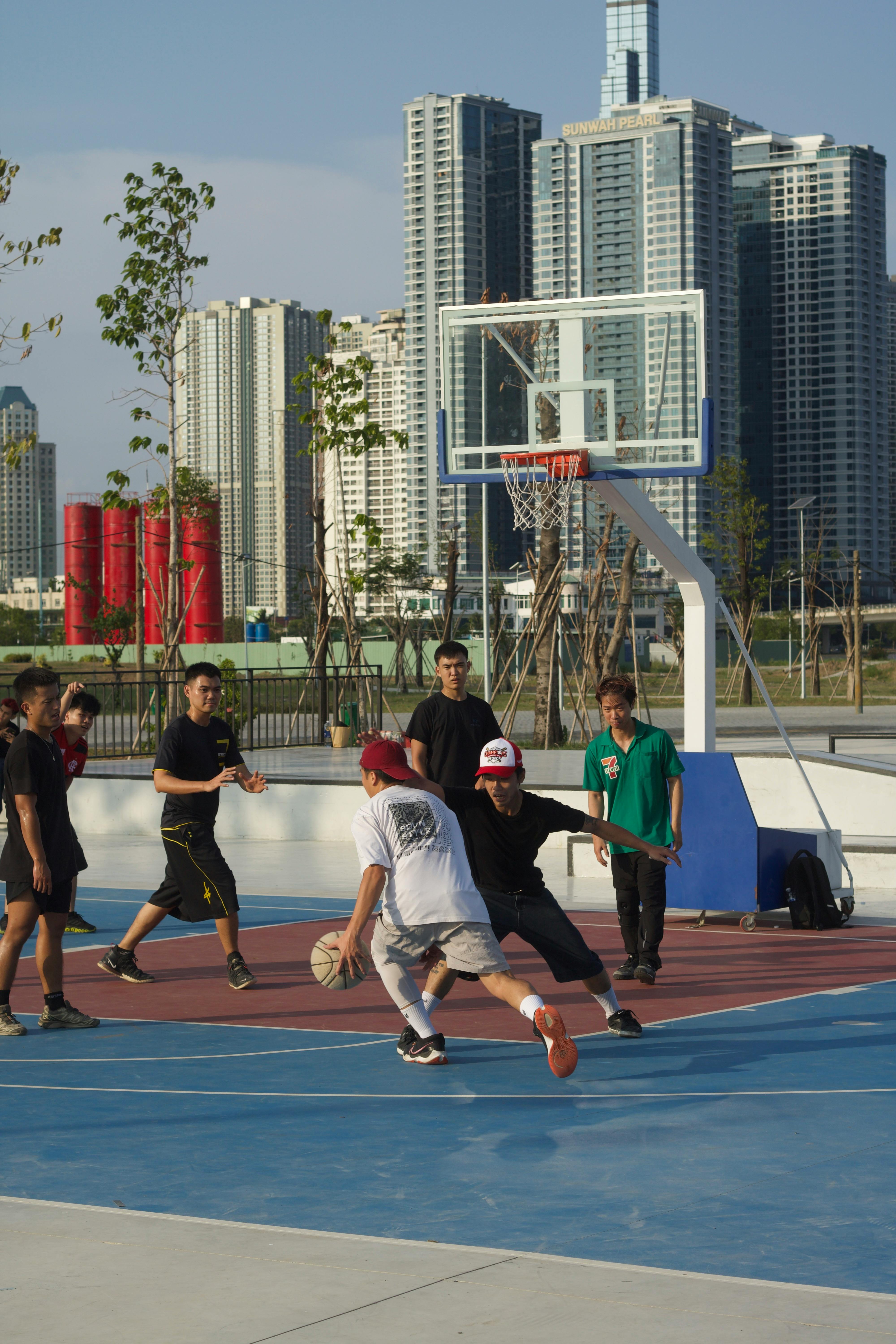 Vibrant Street Basketball Game in Saigon · Free Stock Photo