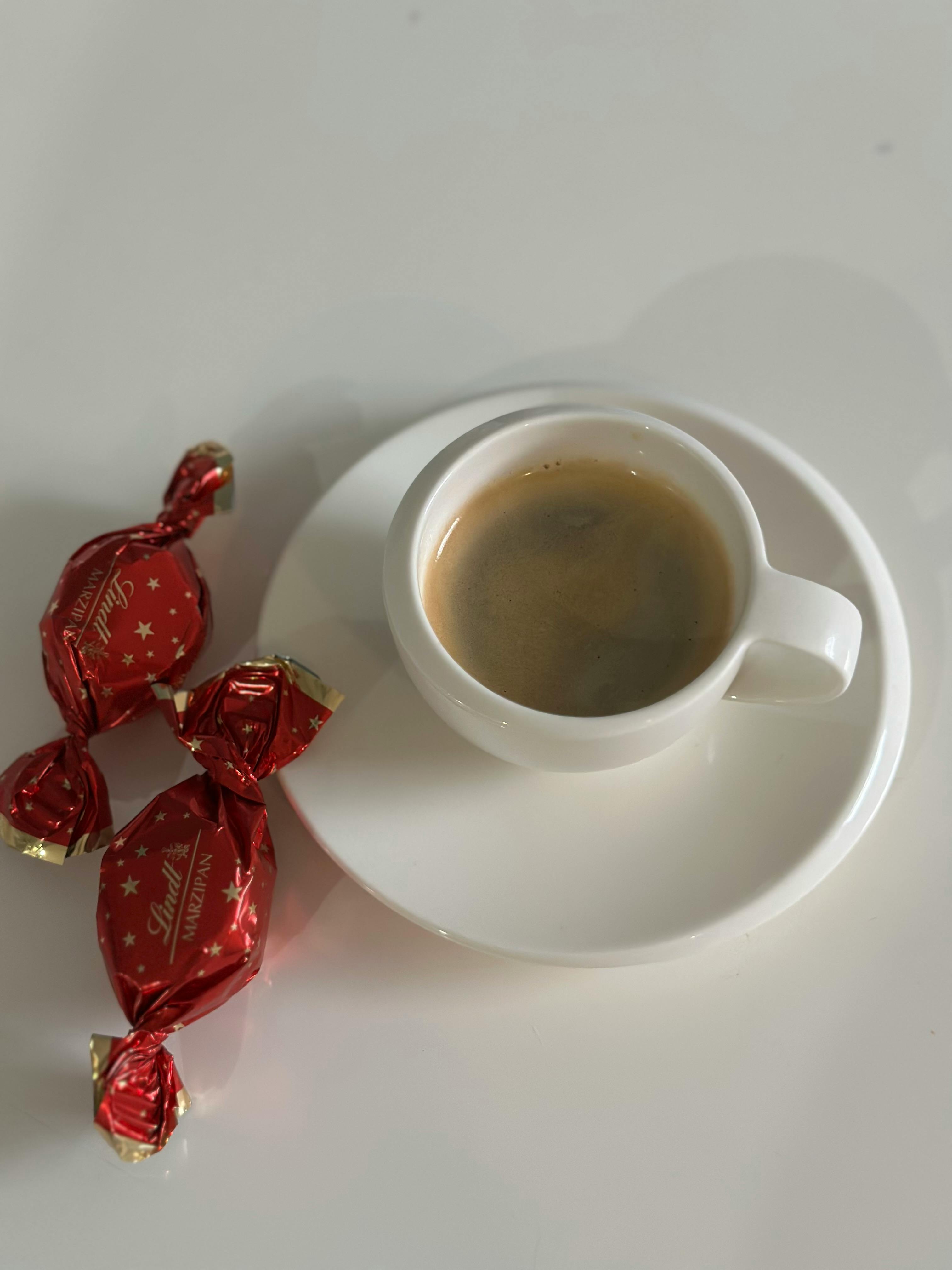 Coffee Cup with Lindt Chocolate Candies · Free Stock Photo