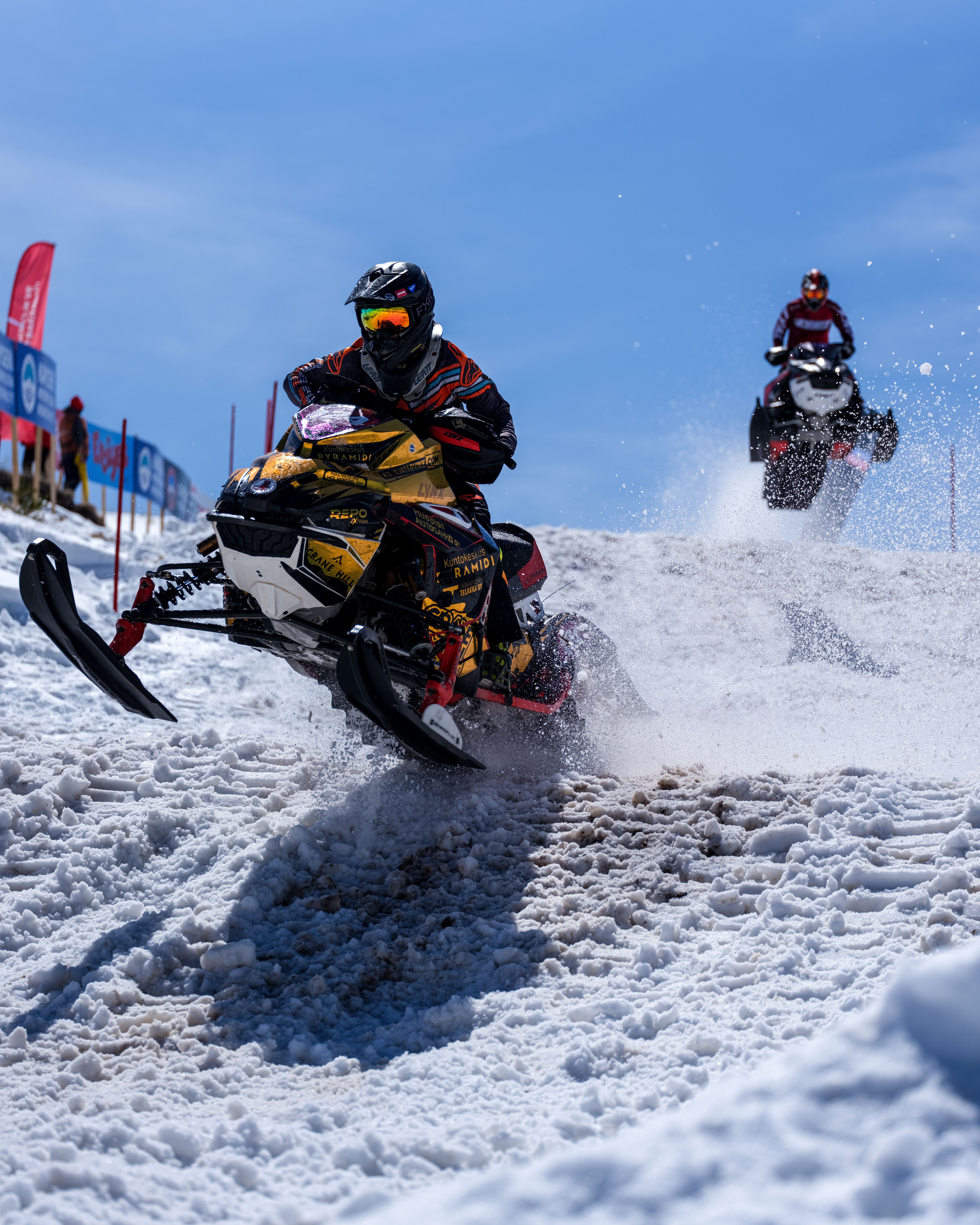 Exciting Snowmobile Race in Winter Landscape · Free Stock Photo