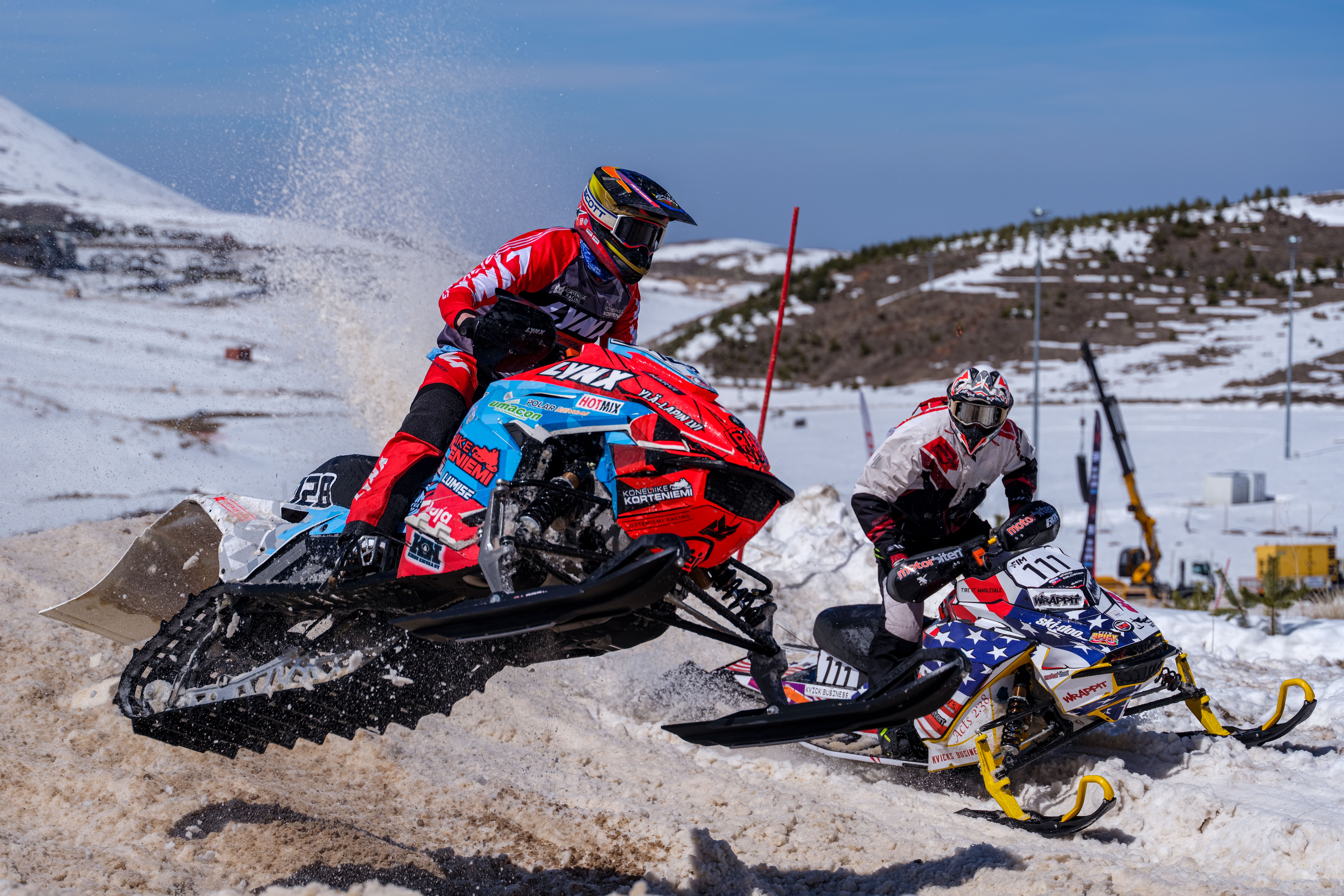 Dynamic Snowmobile Race in Winter Landscape · Free Stock Photo