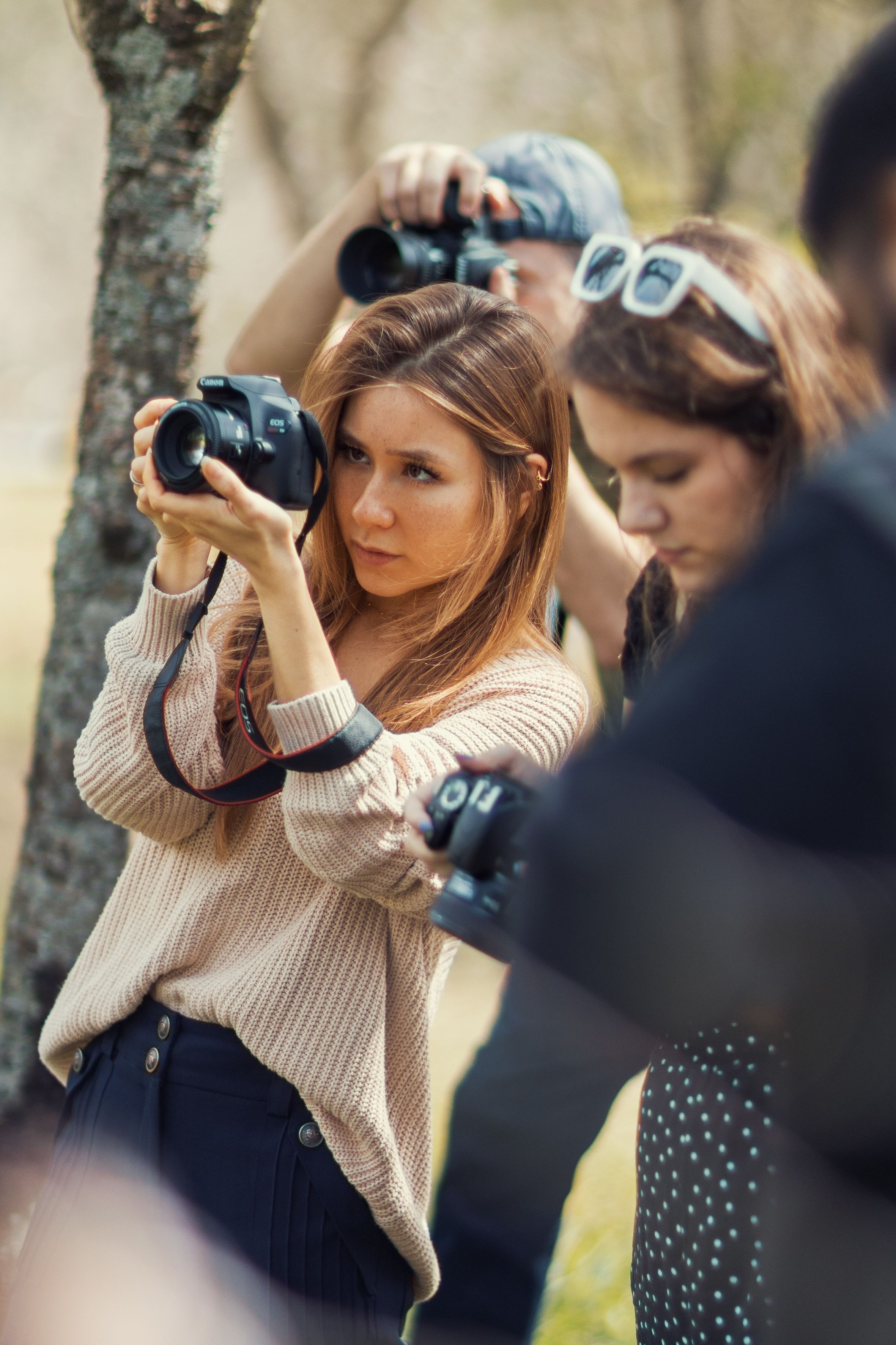 Young Photographers Capturing Nature Outdoors · Free Stock Photo