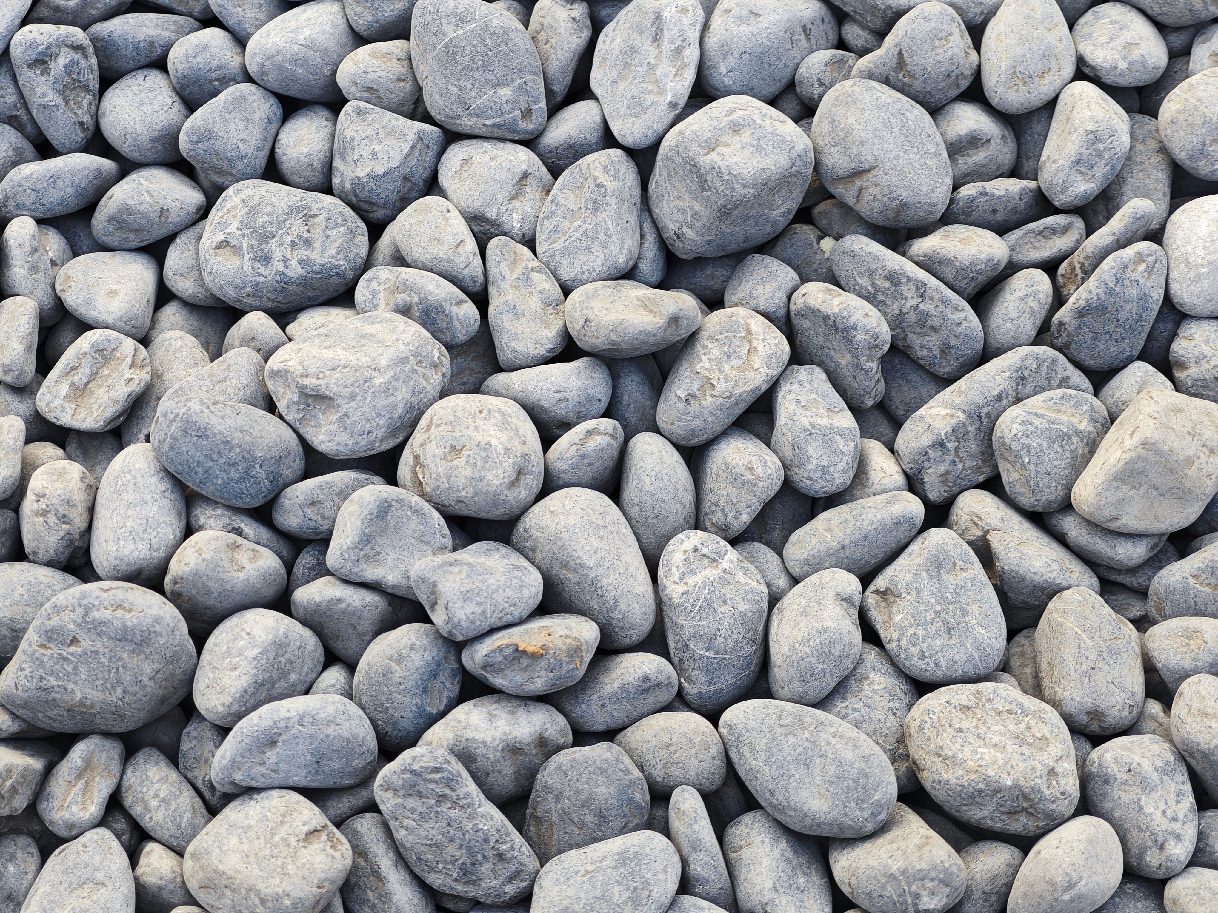 Close-up of Smooth Gray Pebbles Surface Texture · Free Stock Photo