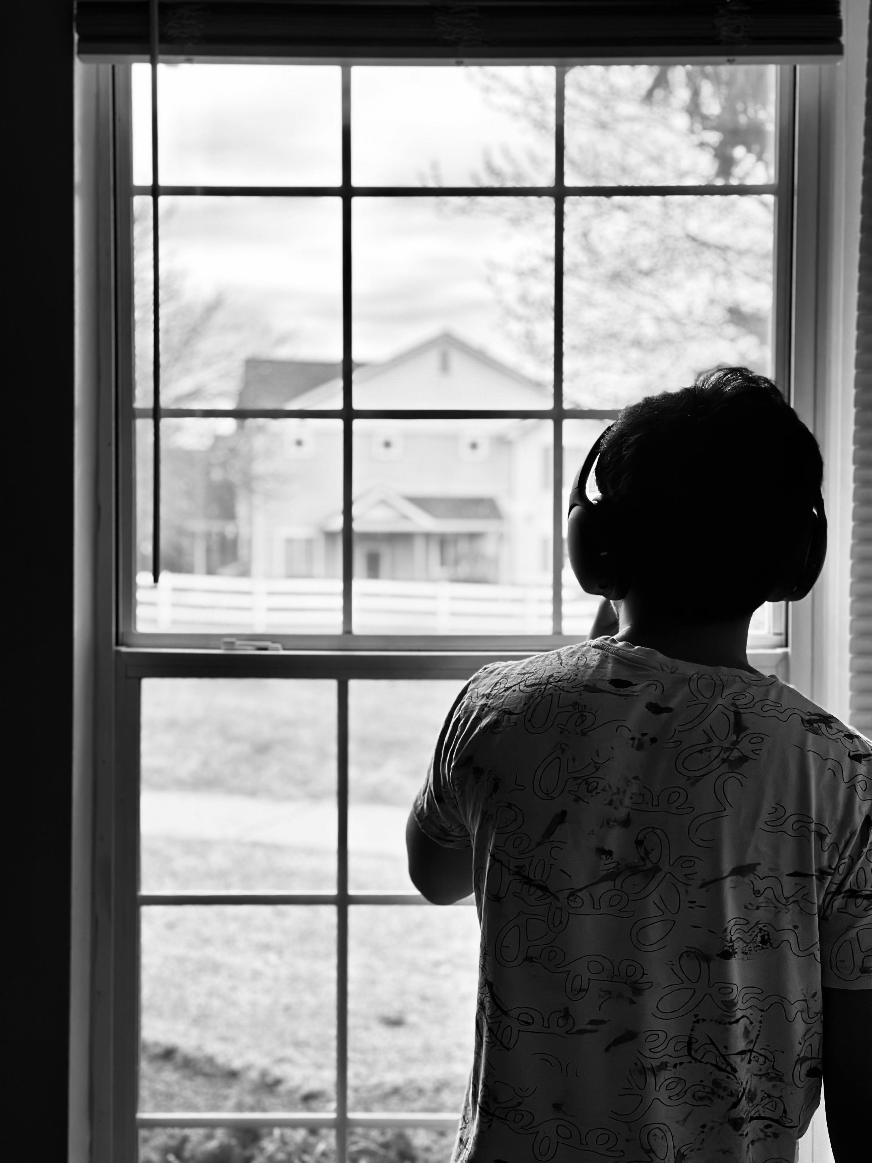 Contemplation through Window in Black and White · Free Stock Photo