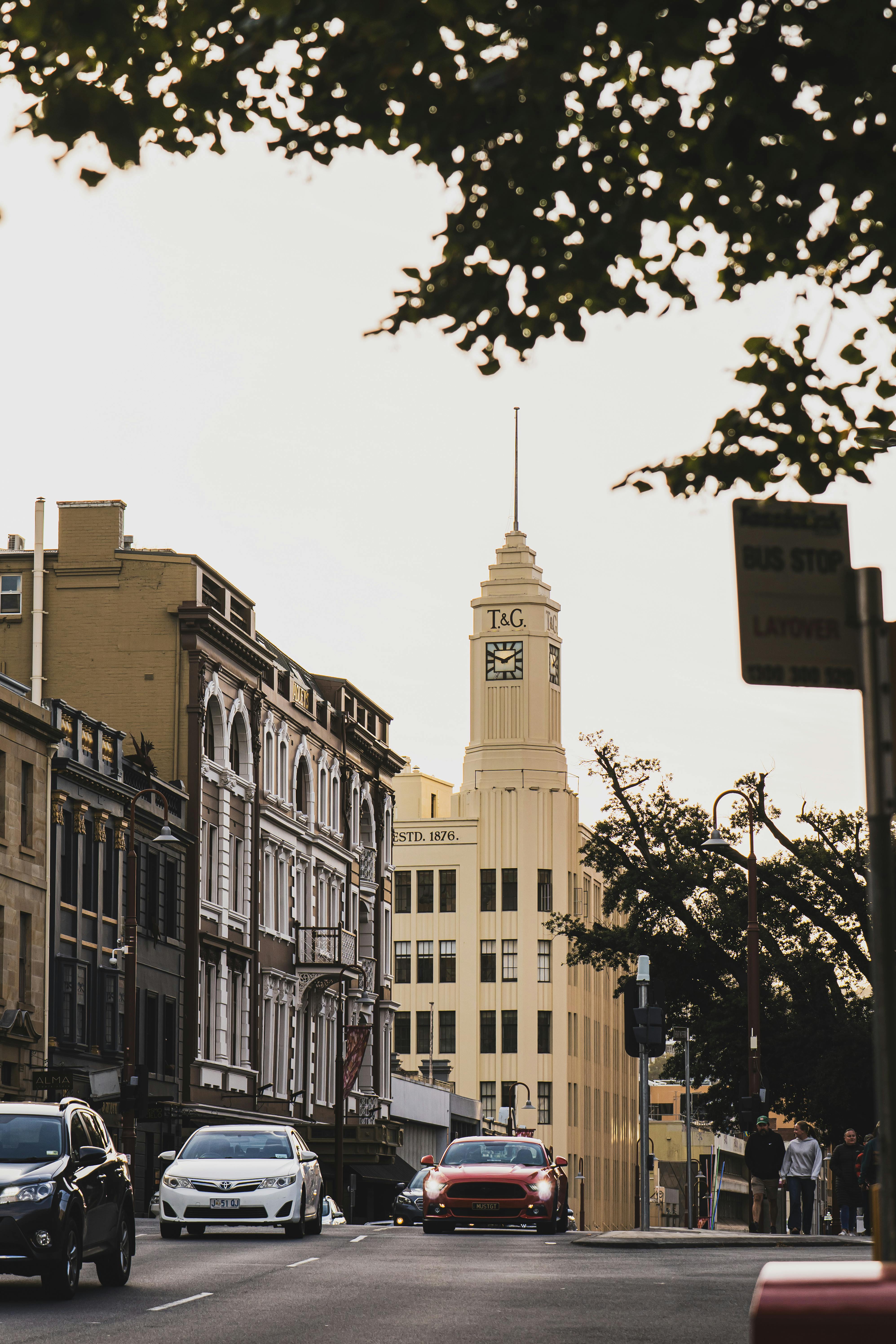 Historic Street View with Iconic Clock Tower · Free Stock Photo