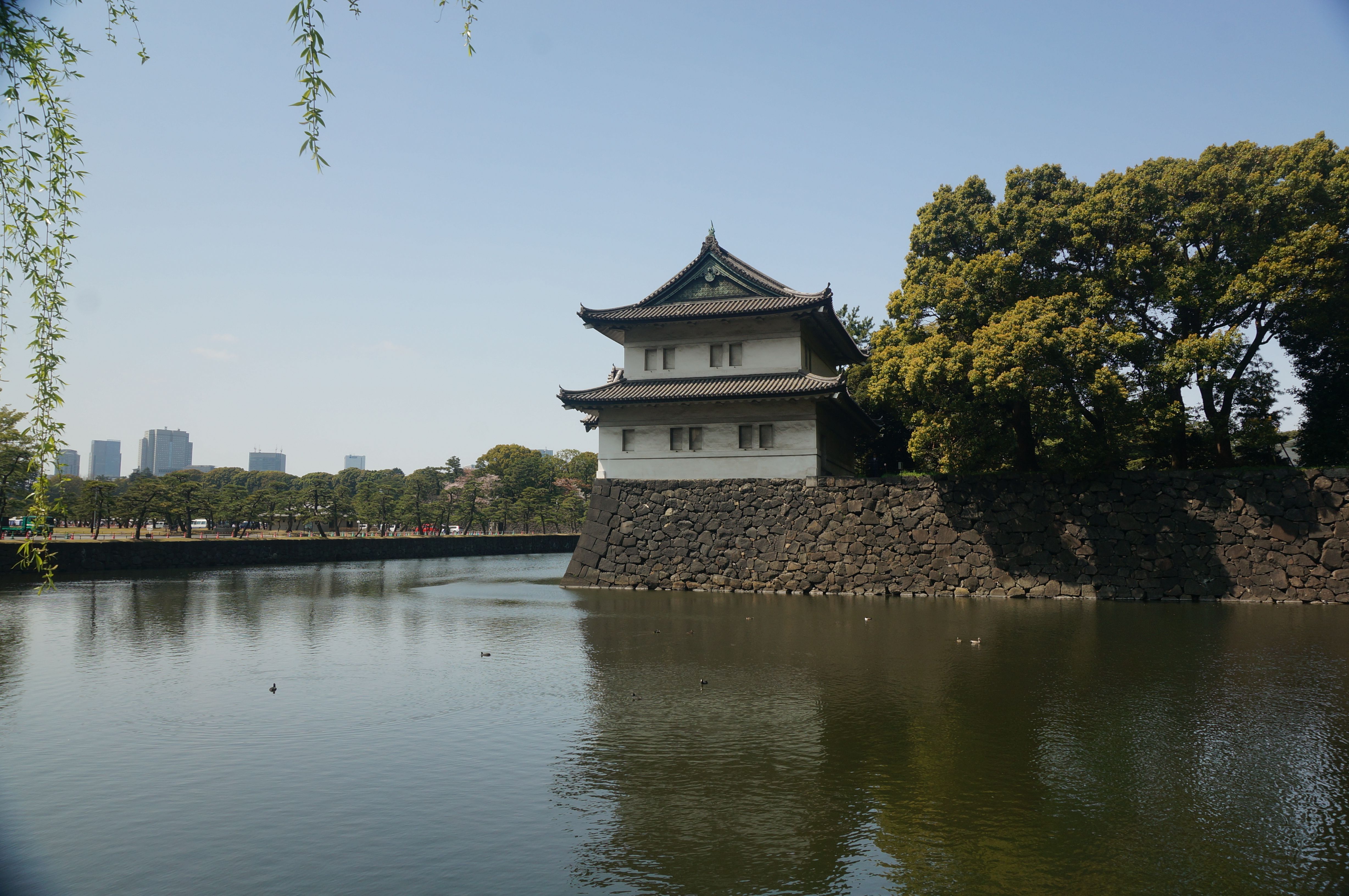 Traditional Japanese Castle by a Tranquil Moat · Free Stock Photo