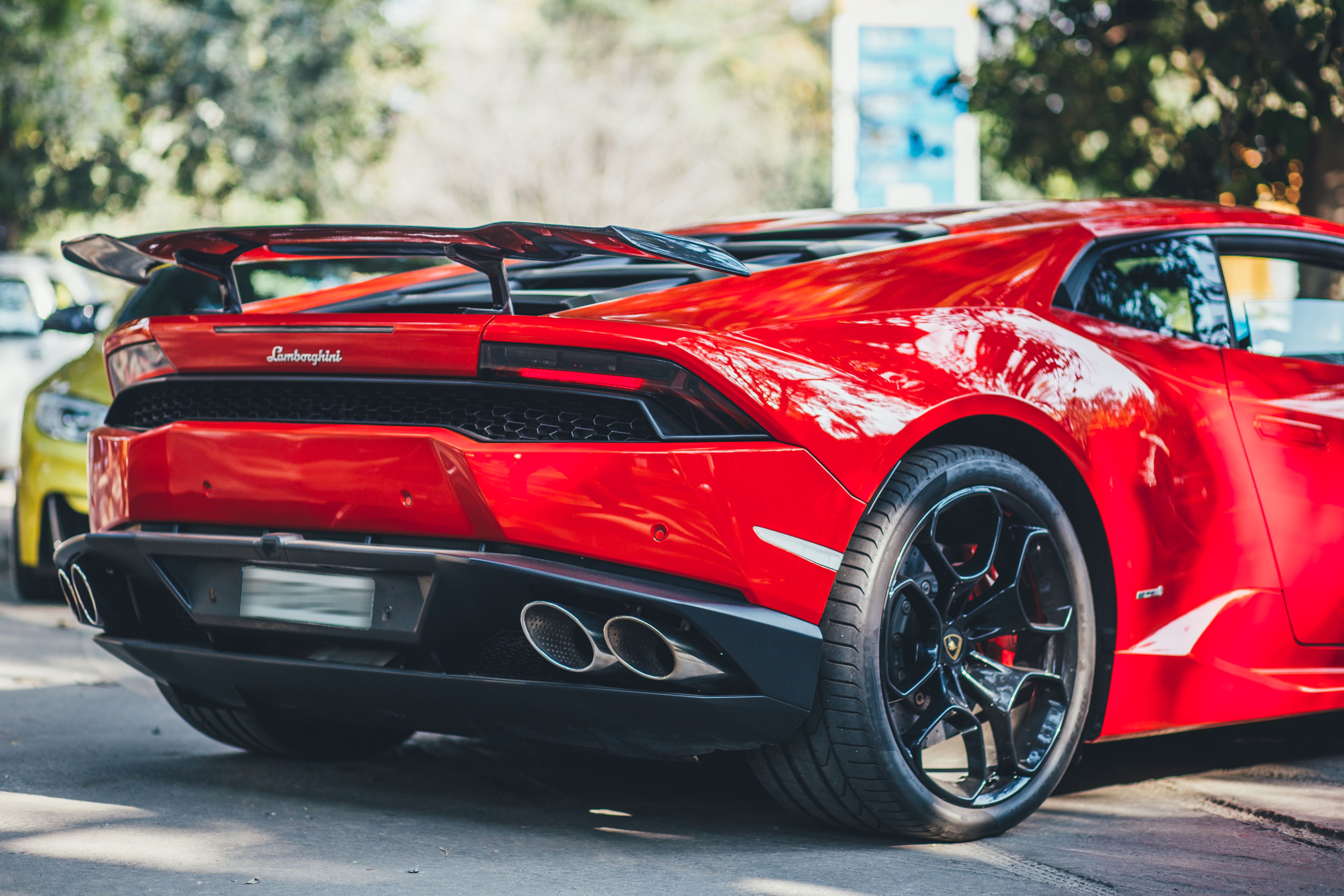Vibrant Red Lamborghini Huracan on New Delhi Street · Free Stock Photo