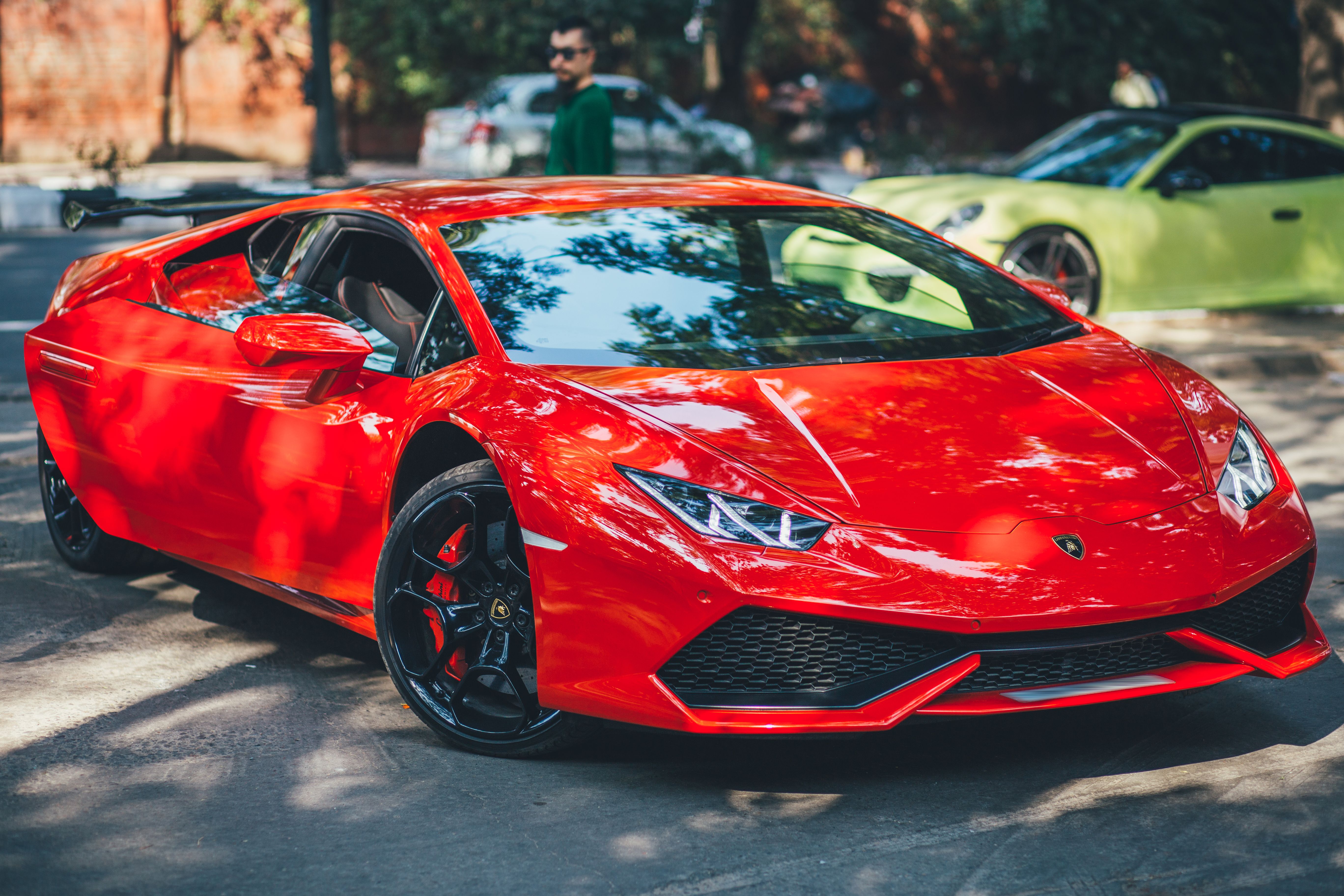 Sleek Red Supercar on Indian City Street · Free Stock Photo