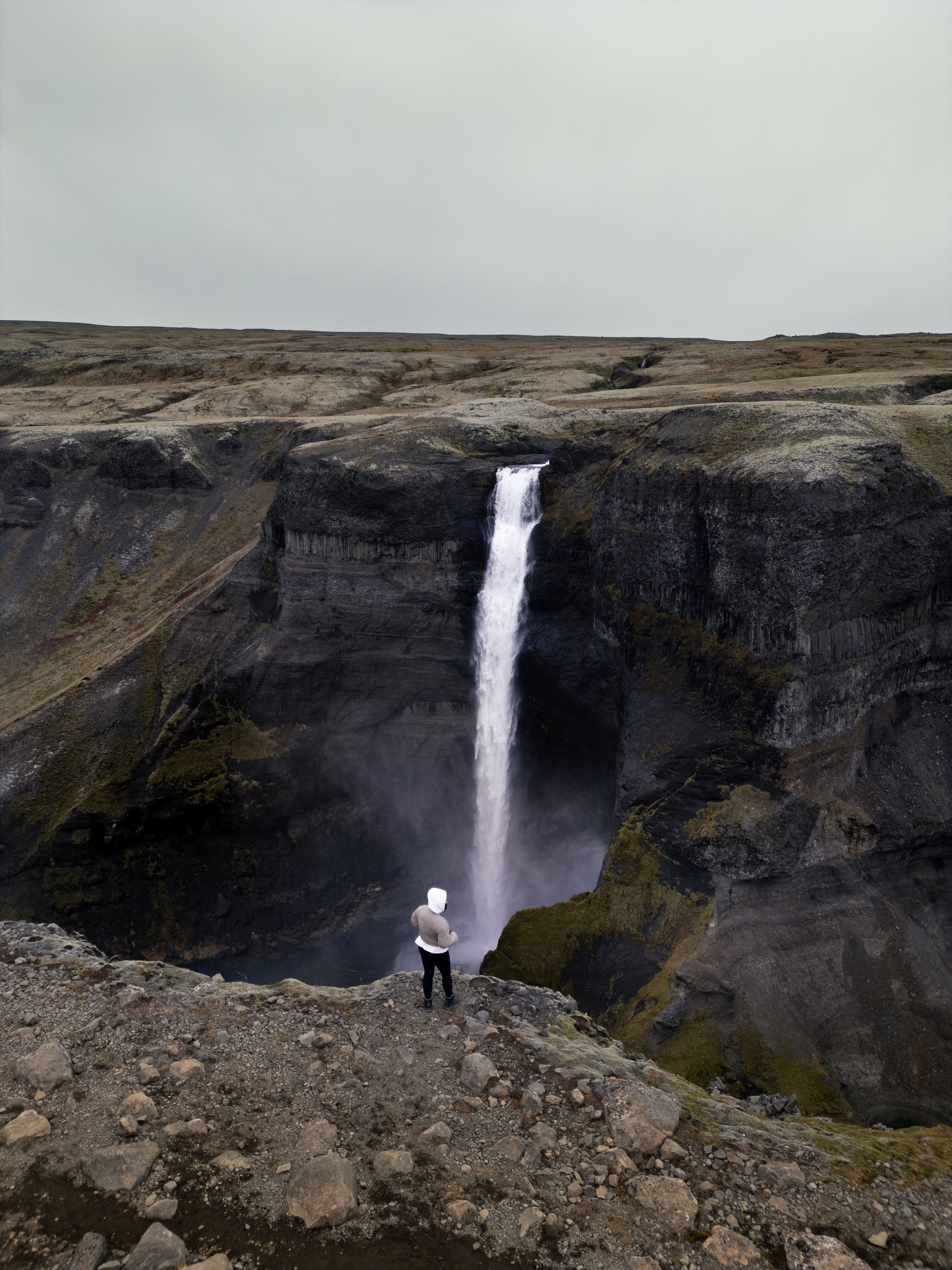 Man Sitting Near Waterfalls · Free Stock Photo