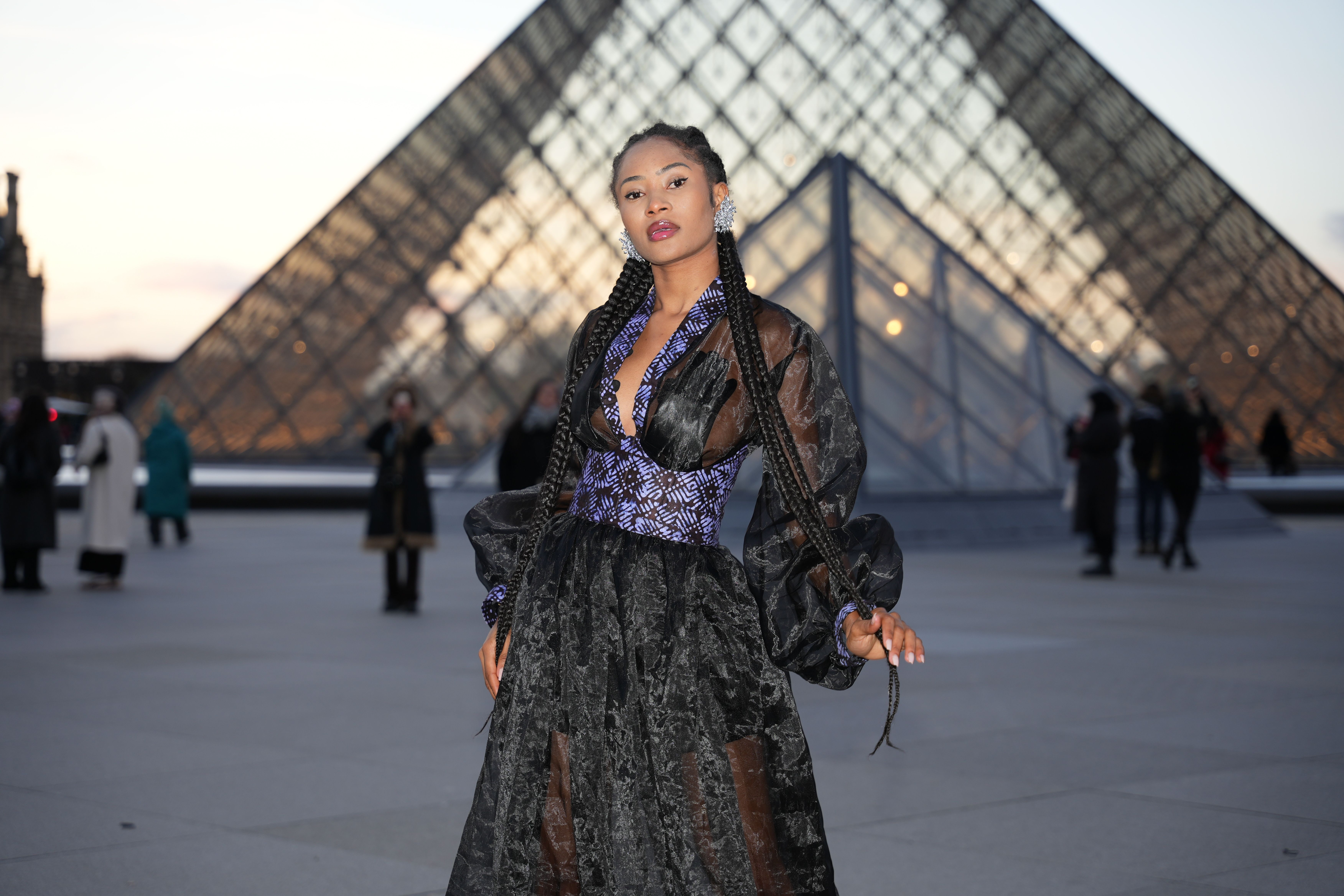 Fashionable Portrait in Front of Louvre Pyramid · Free Stock Photo