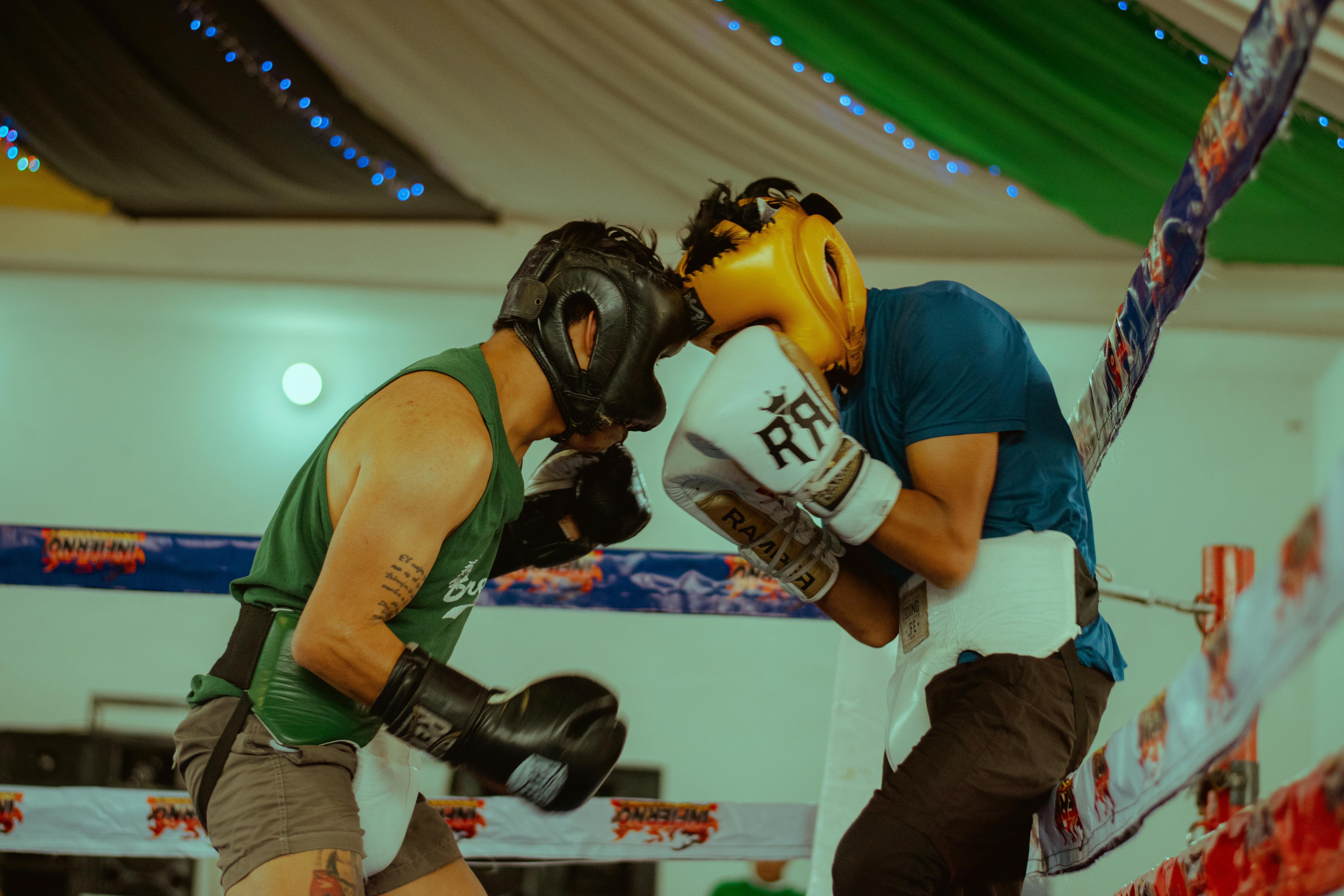 Action-Packed Boxing Match with Protective Gear · Free Stock Photo