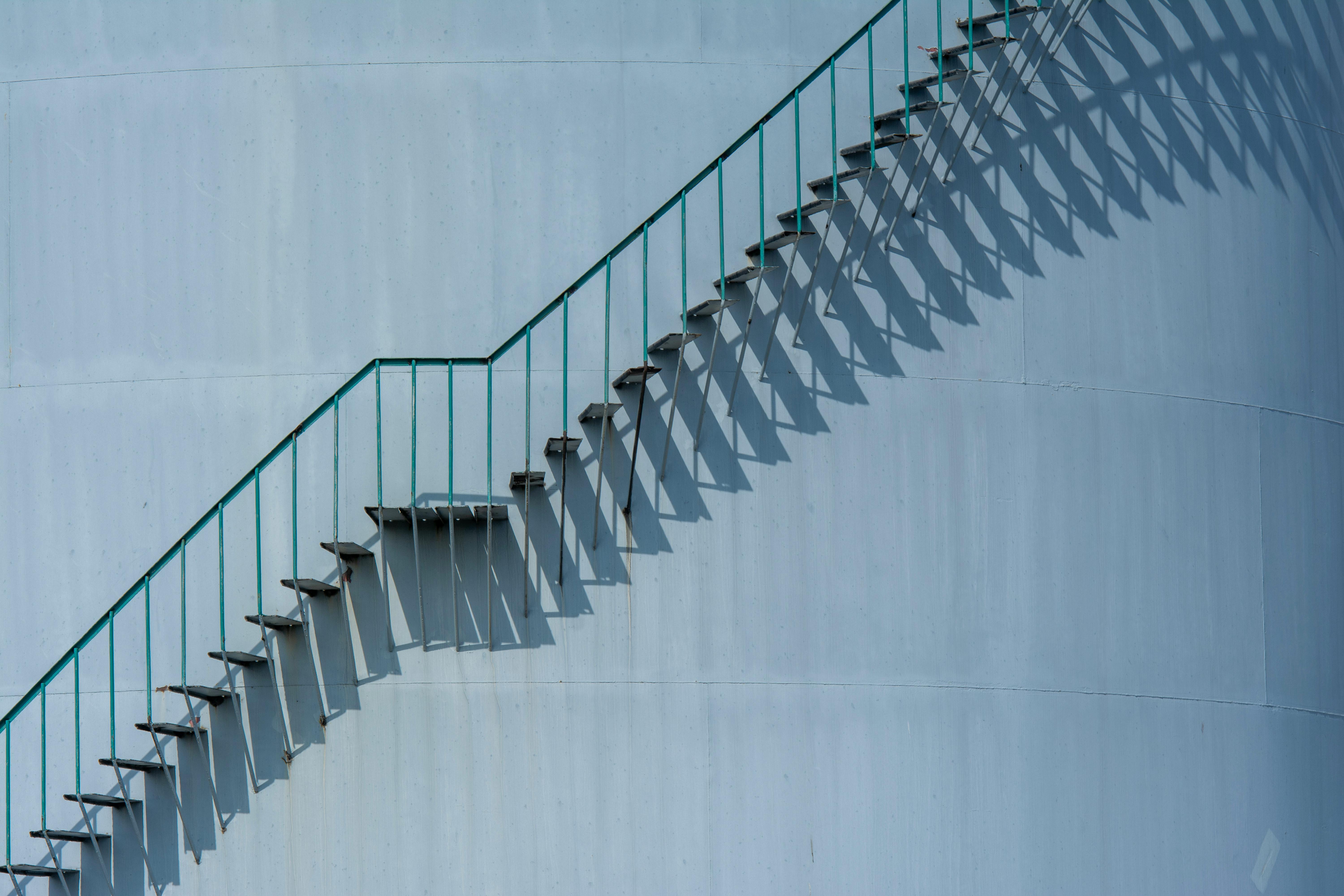 Industrial Staircase Casting Dramatic Shadows · Free Stock Photo