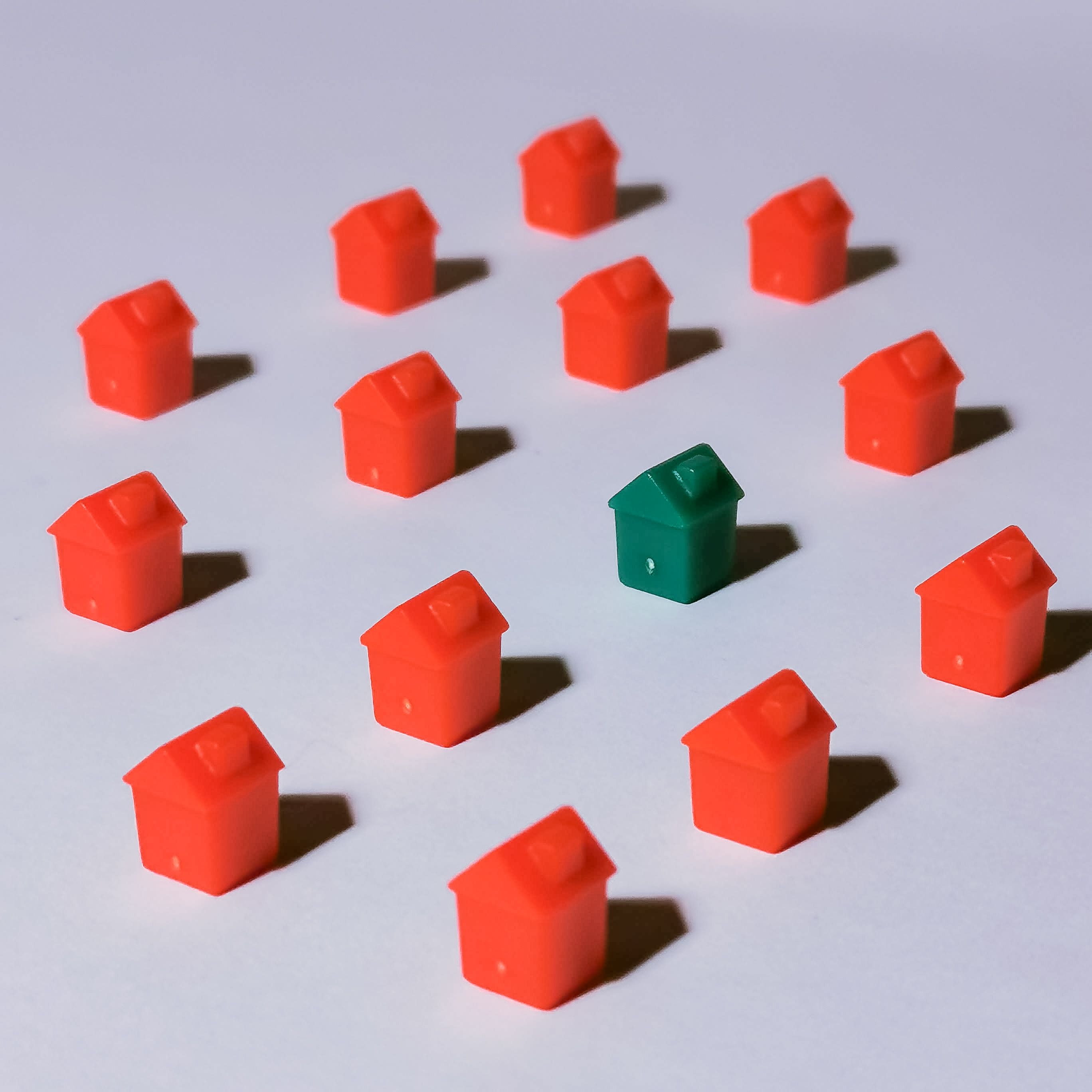 Red and Green Monopoly Houses on White Background · Free Stock Photo
