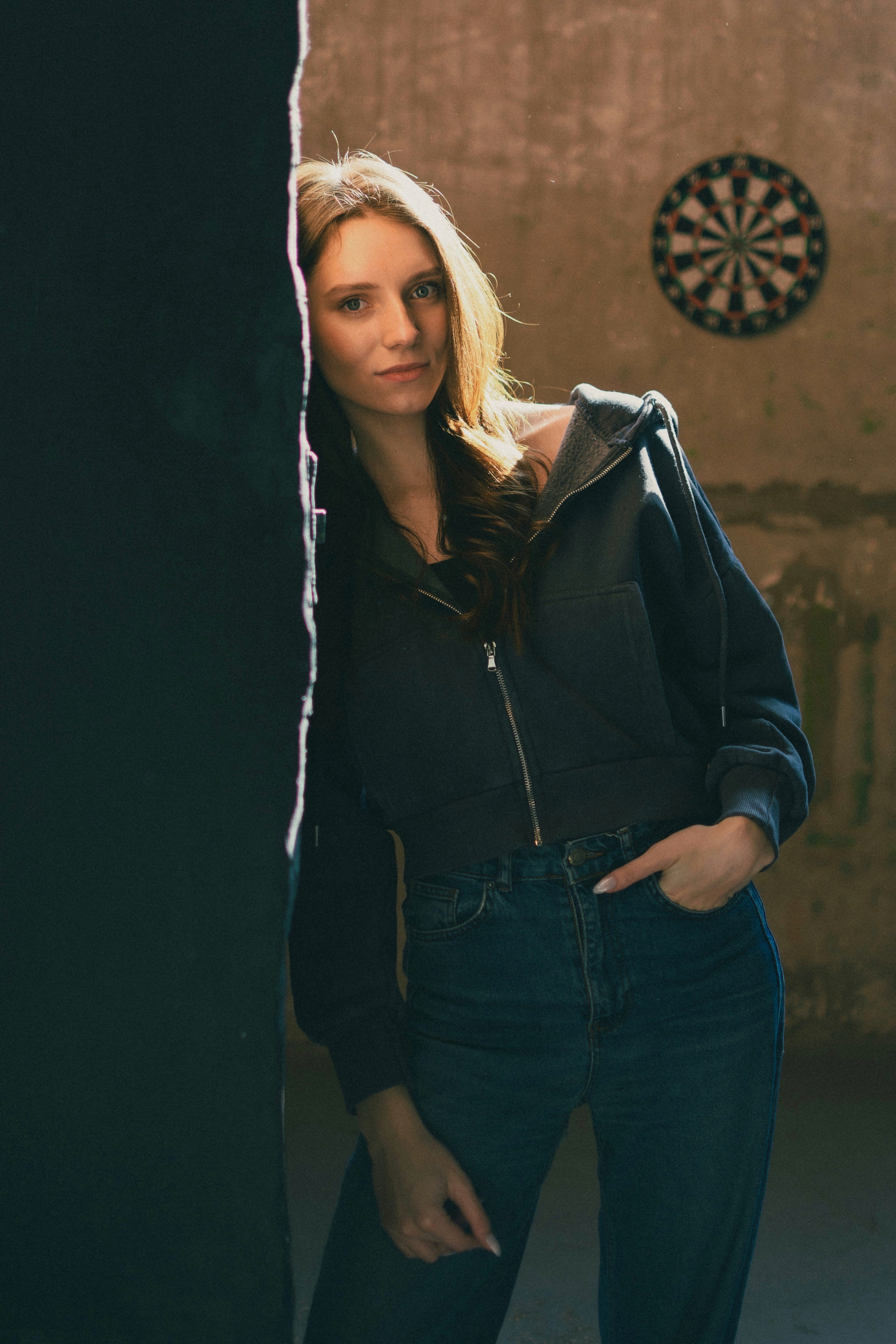 Casual Portrait of Young Woman in Dimly Lit Room · Free Stock Photo
