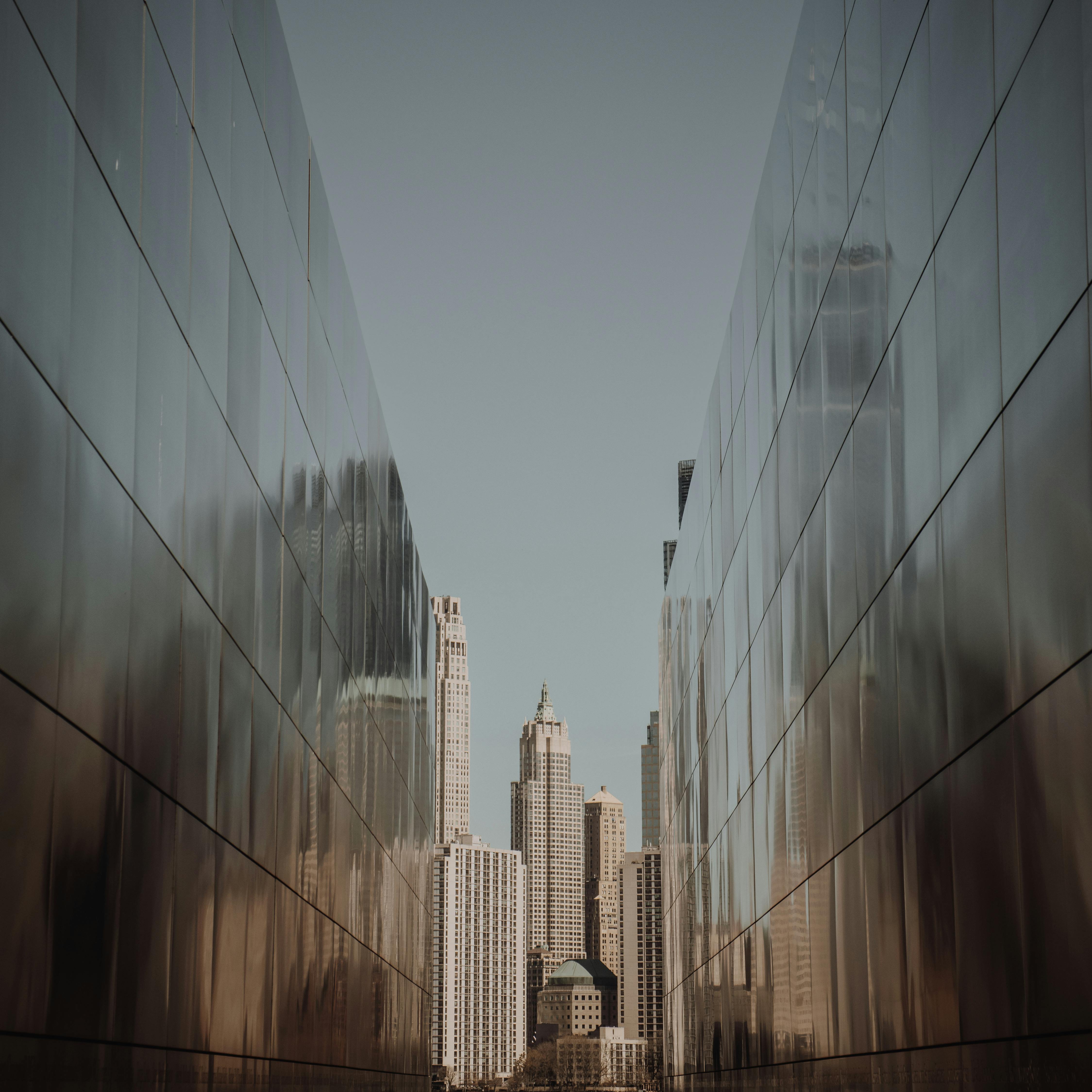 Dramatic Cityscape Through Reflective Walls · Free Stock Photo