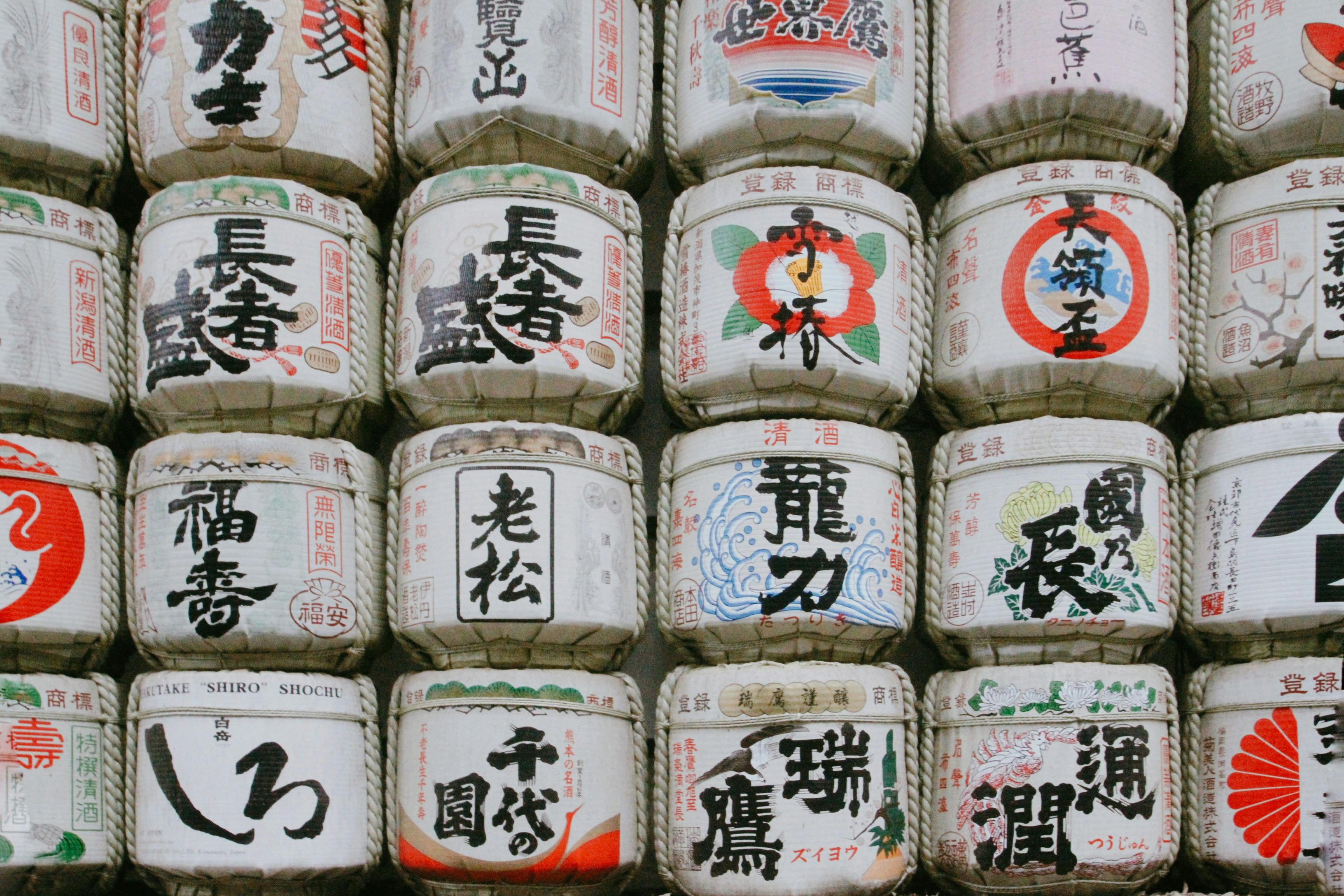 Traditional Japanese Sake Barrels Stacked Display · Free Stock Photo