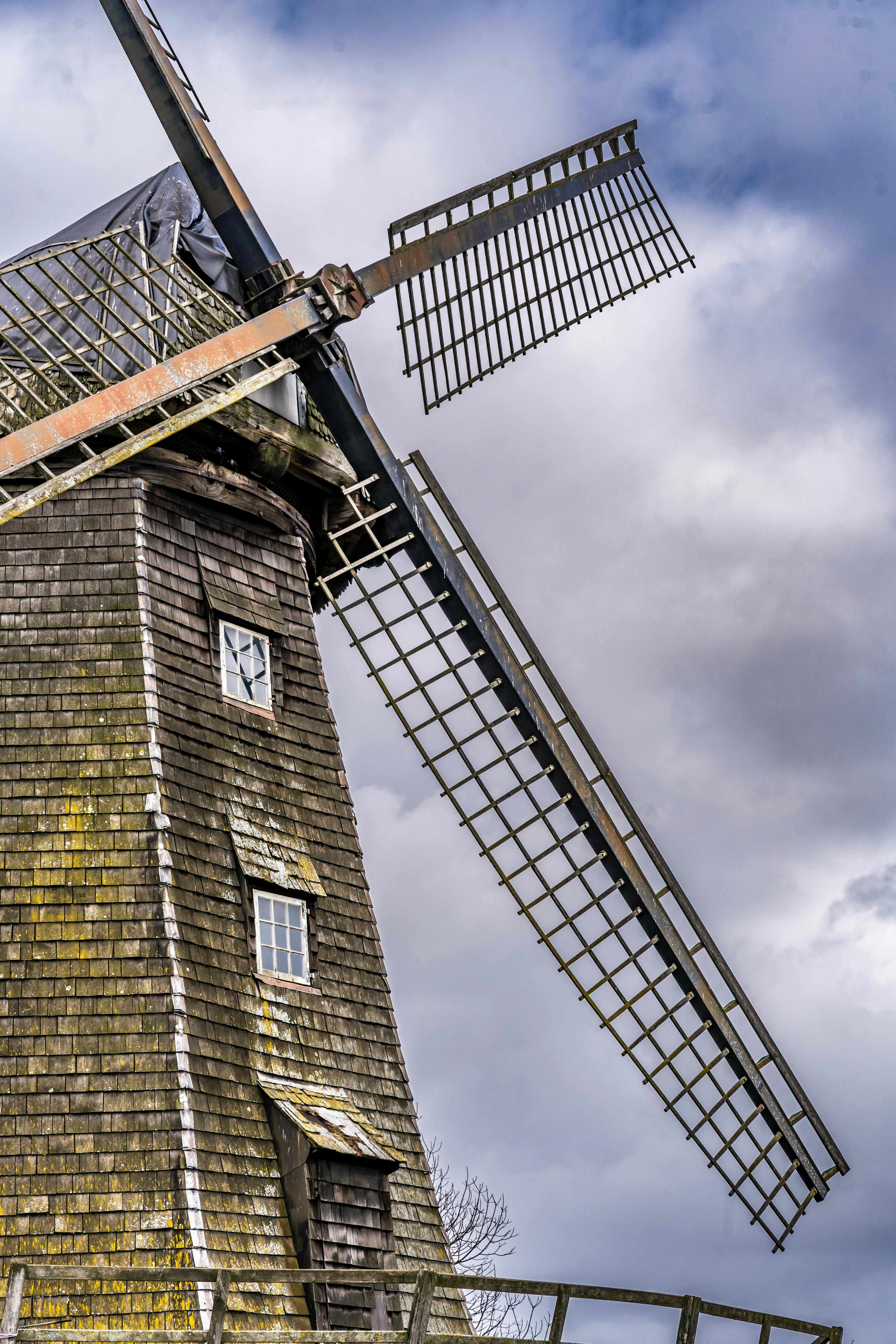 Historic Wooden Windmill on Cloudy Day · Free Stock Photo