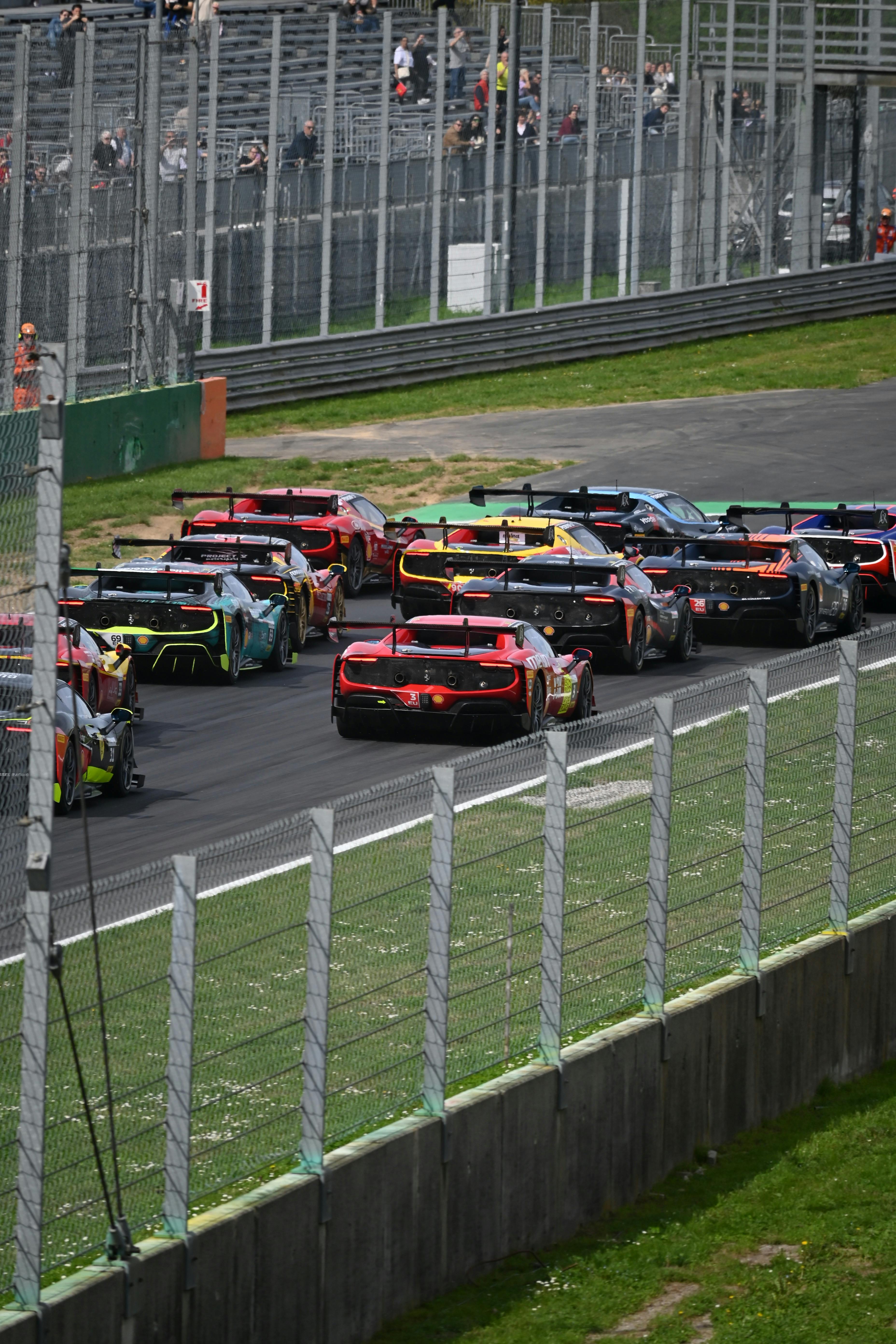 Exciting Car Race at Monza Circuit · Free Stock Photo