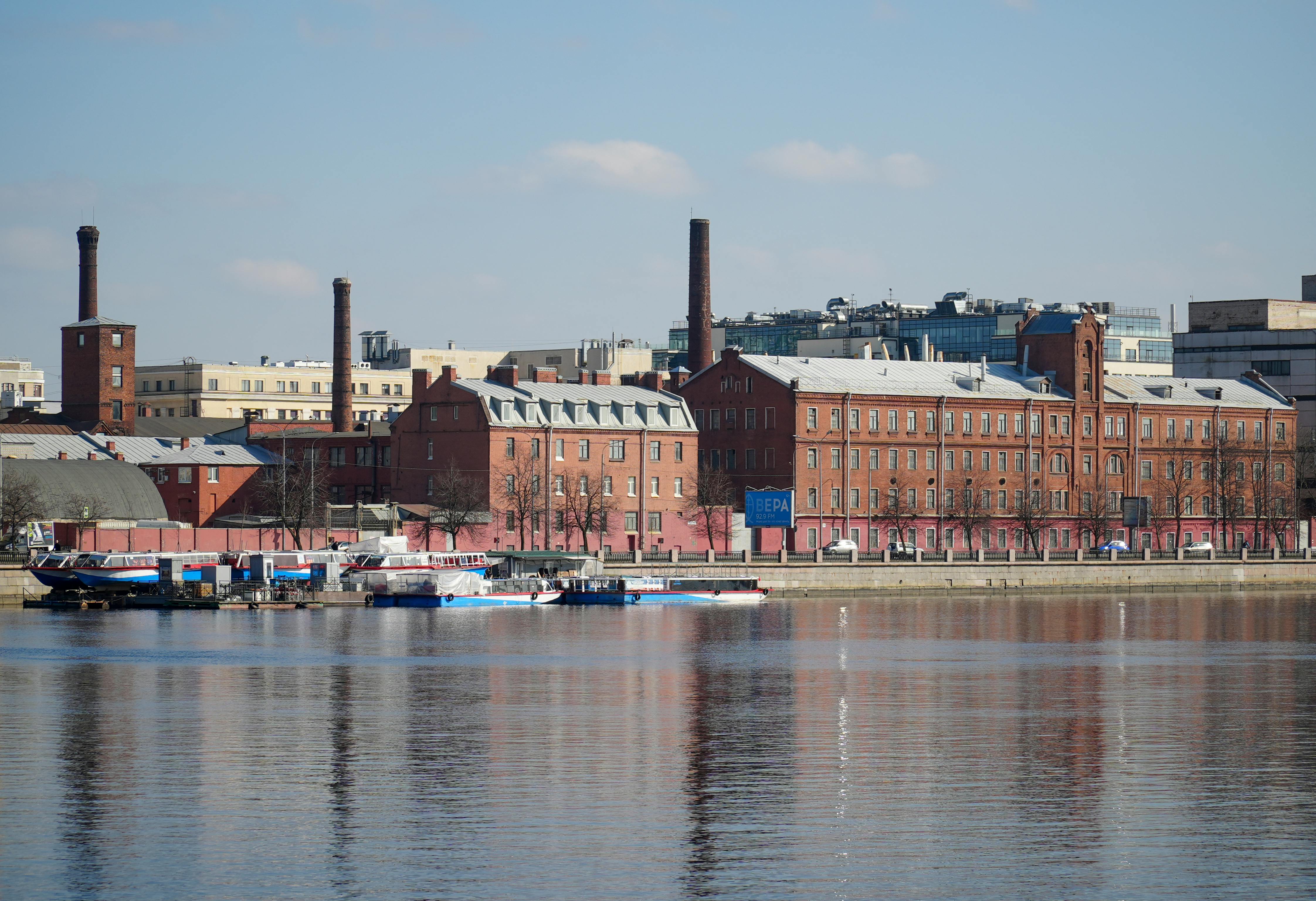 Red Brick Industrial Buildings by Waterfront · Free Stock Photo