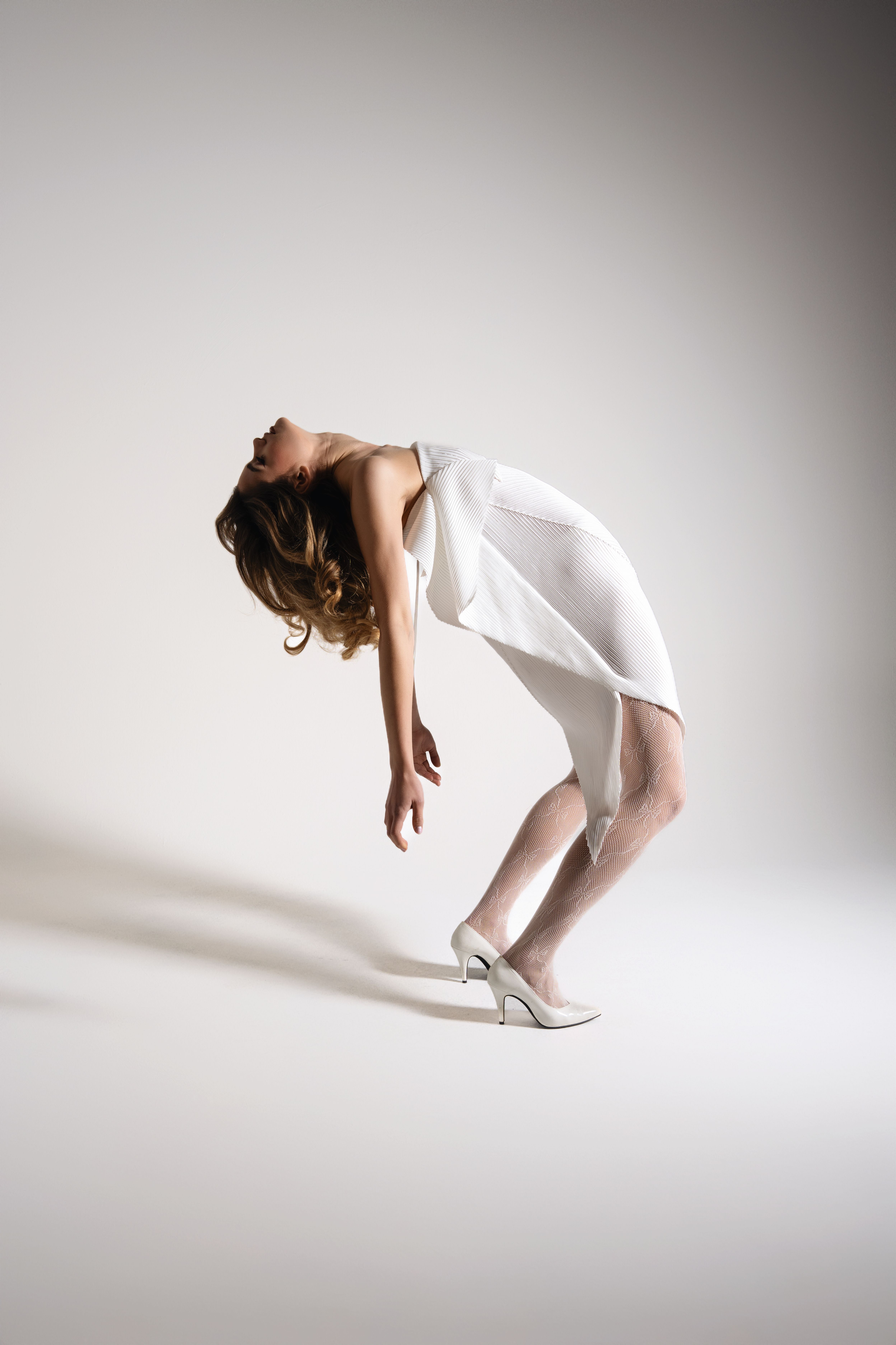 Ethereal Fashion Pose in Studio Setting · Free Stock Photo