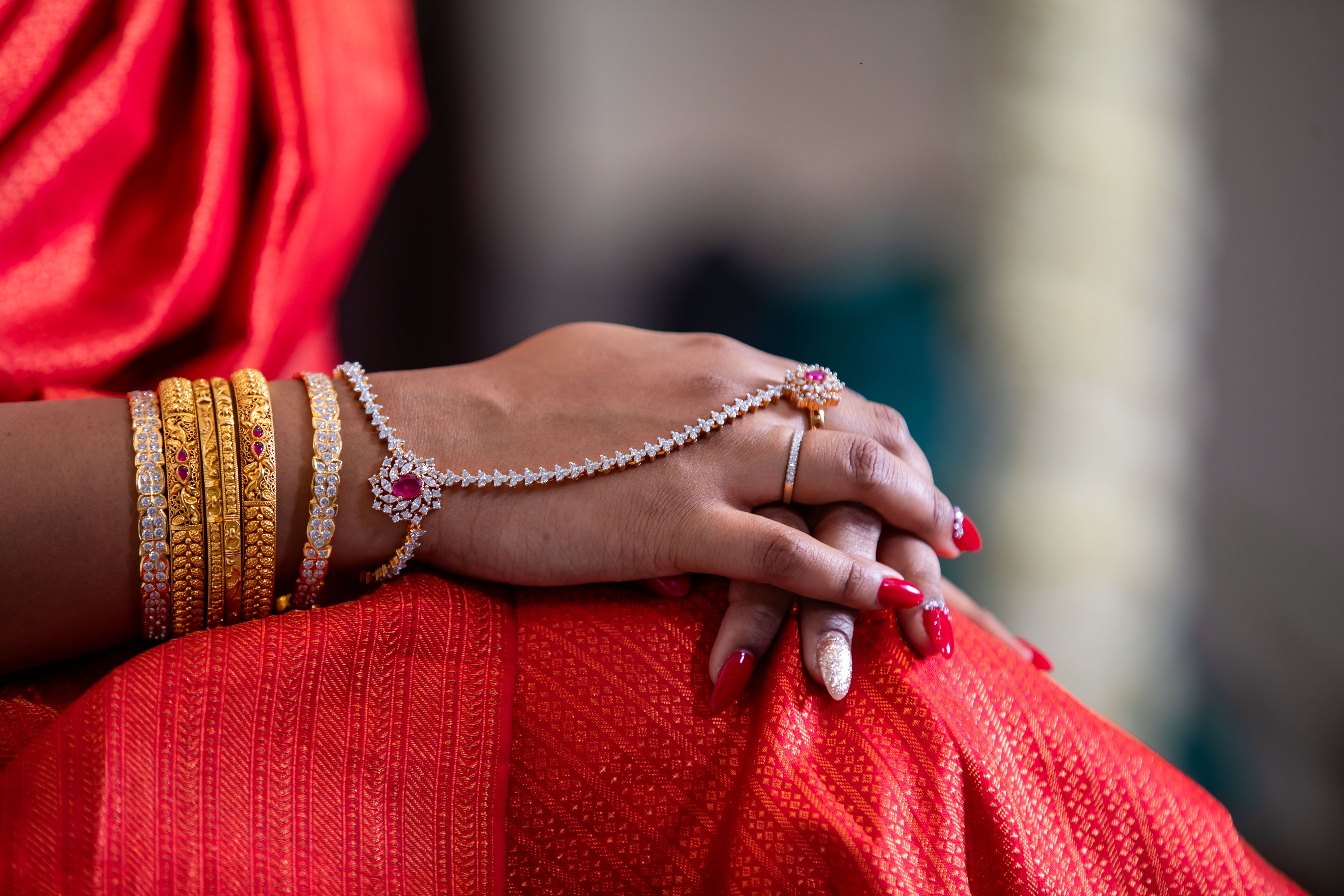 Elegant Hand Adorned with Gold and Diamond Jewelry · Free Stock Photo