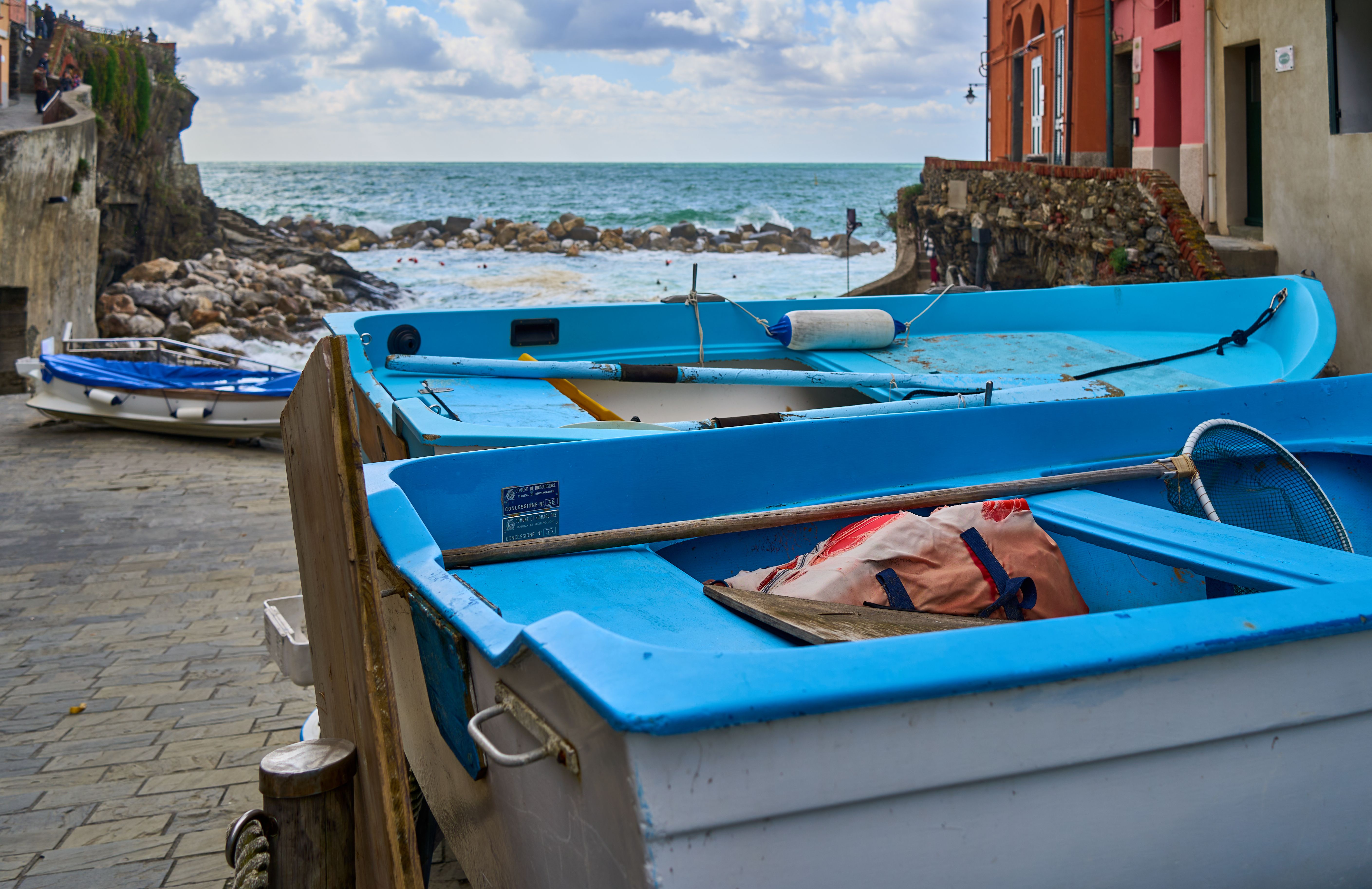 Scenic Coastal View with Blue Fishing Boats · Free Stock Photo
