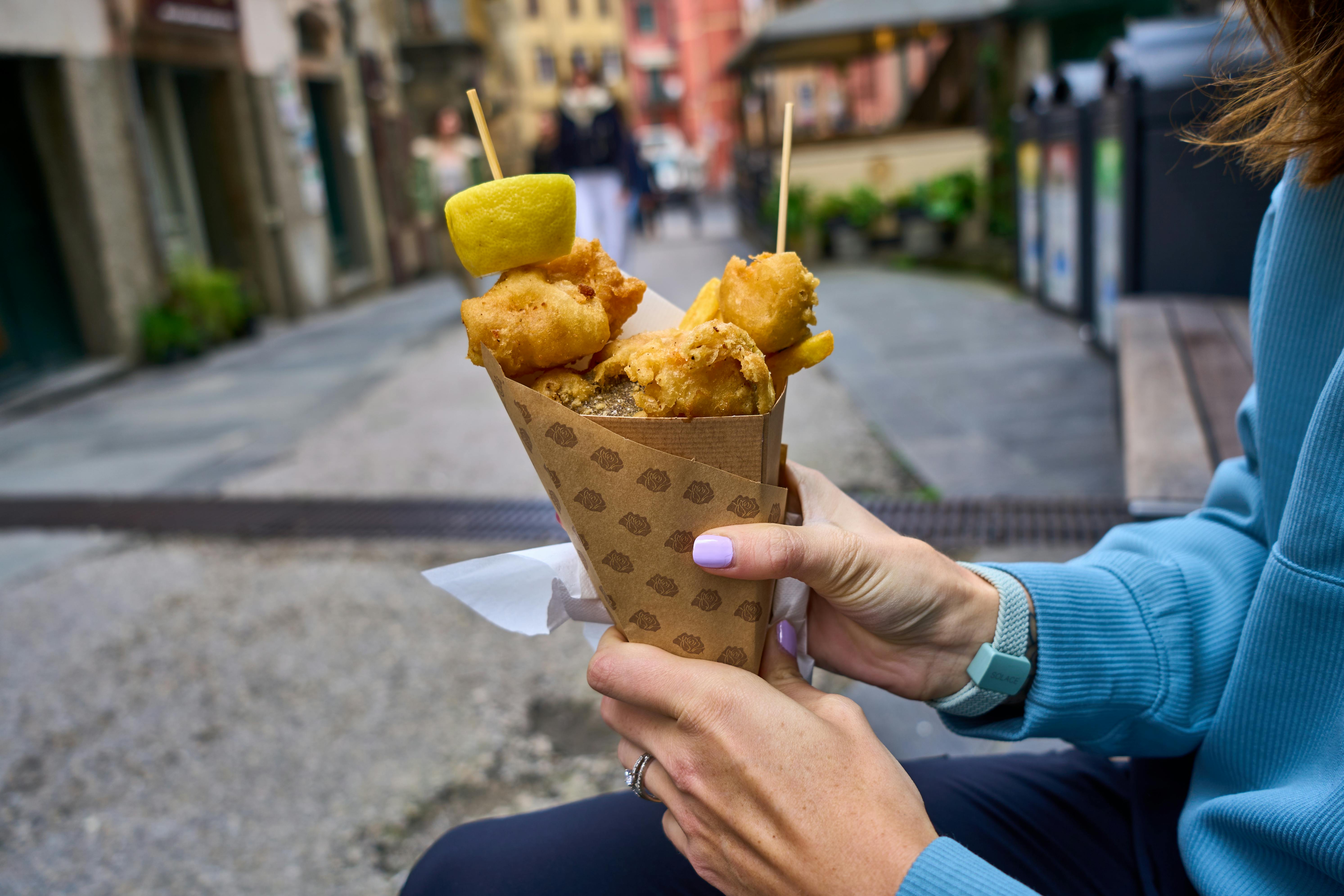 Street Food Snack in Paper Cone Outdoors · Free Stock Photo