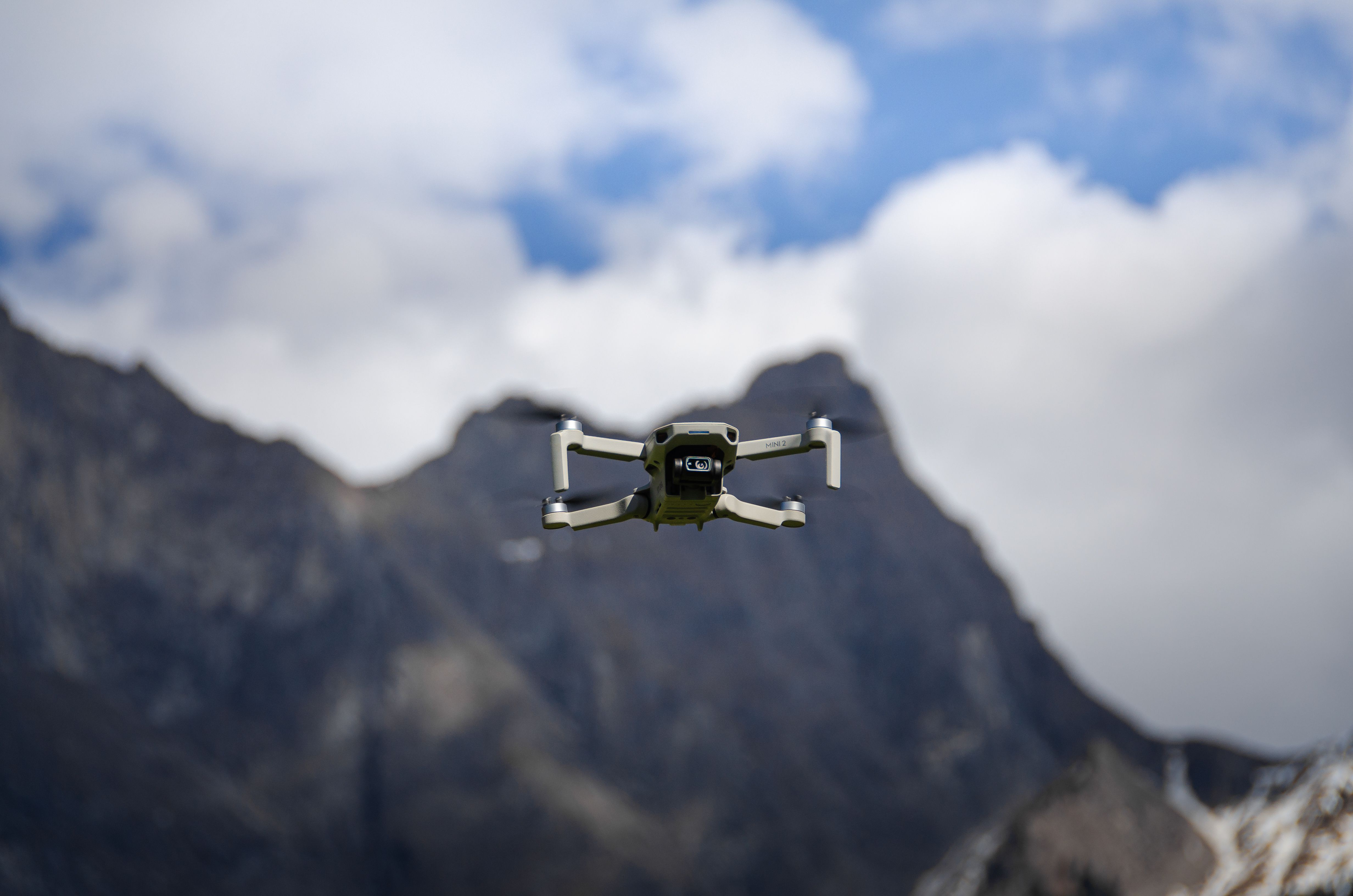 Drone Flying in Mountainous Terrain · Free Stock Photo