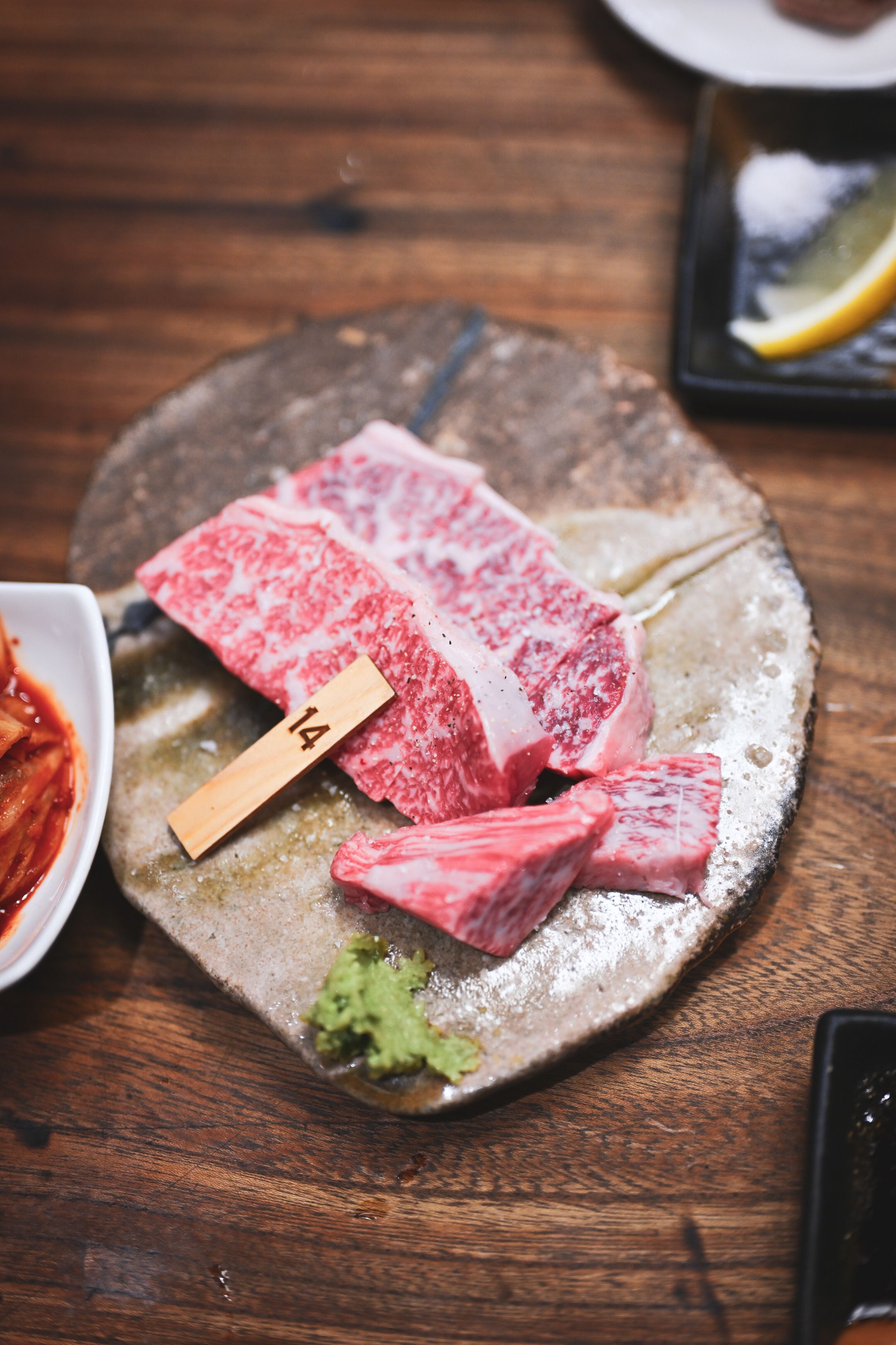 Exquisite Wagyu Beef Slices on Ceramic Plate · Free Stock Photo