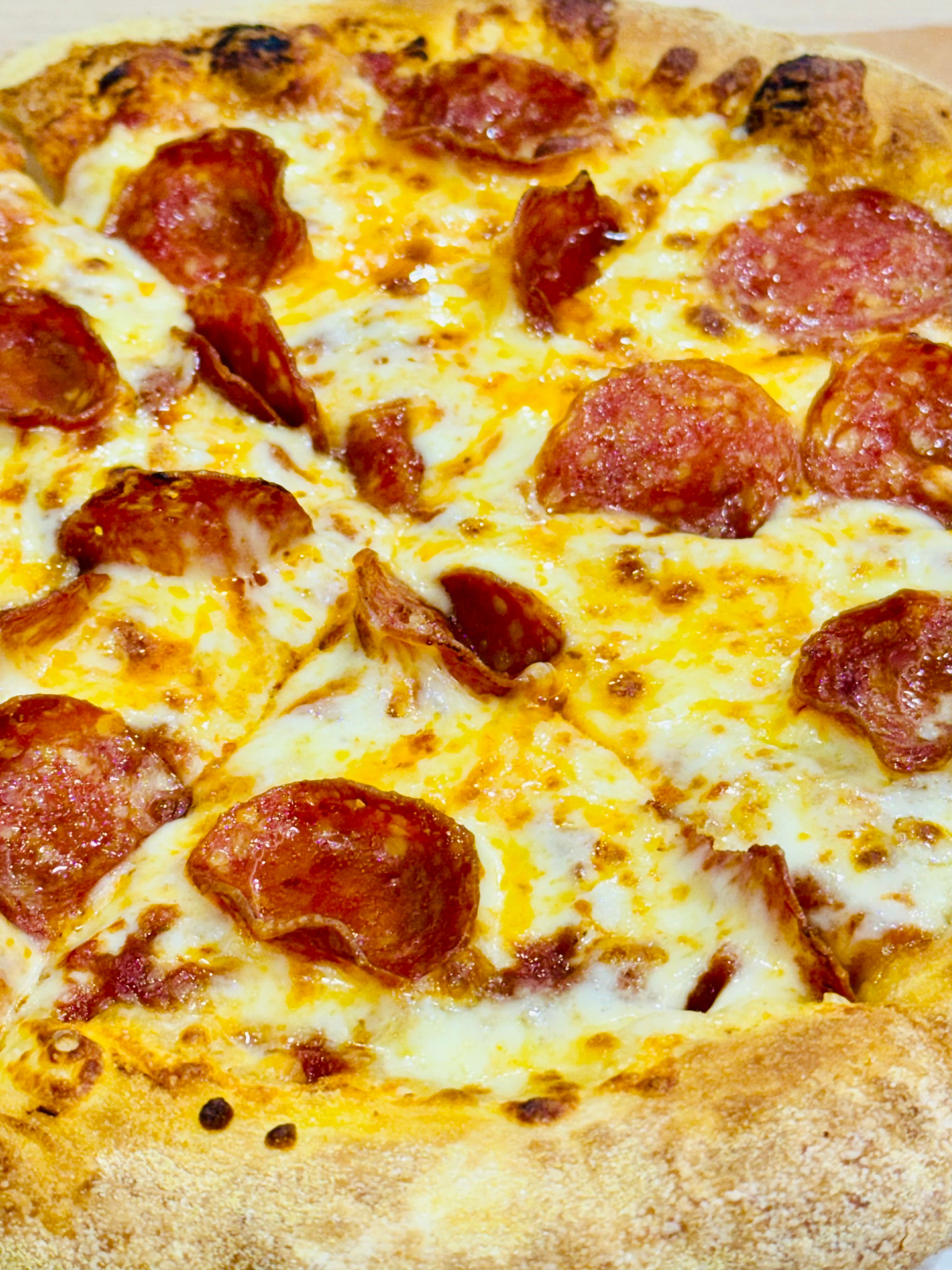Sliced Pepperoni Pizza In Close-up View · Free Stock Photo