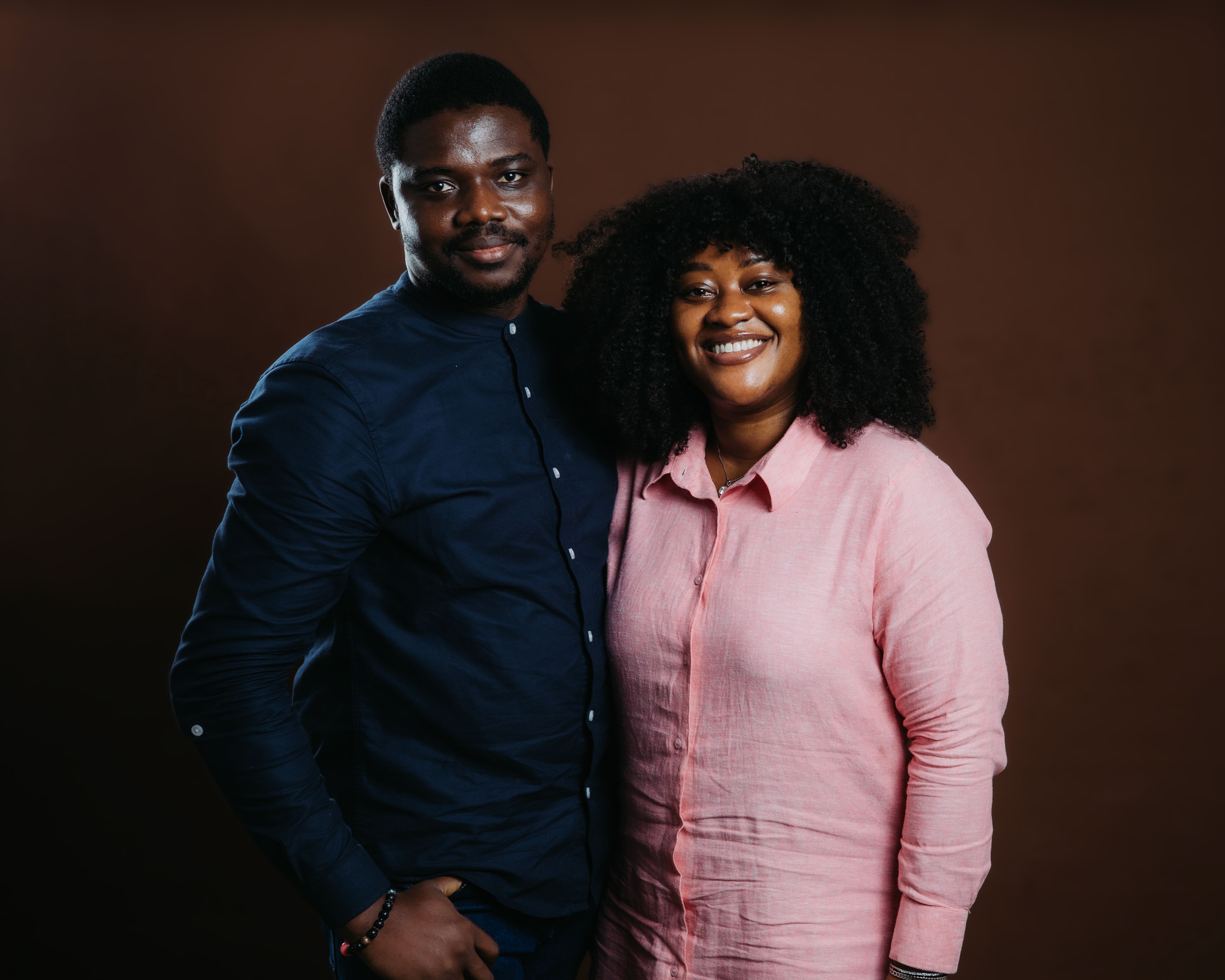 Smiling Couple Portrait in Studio Setting · Free Stock Photo