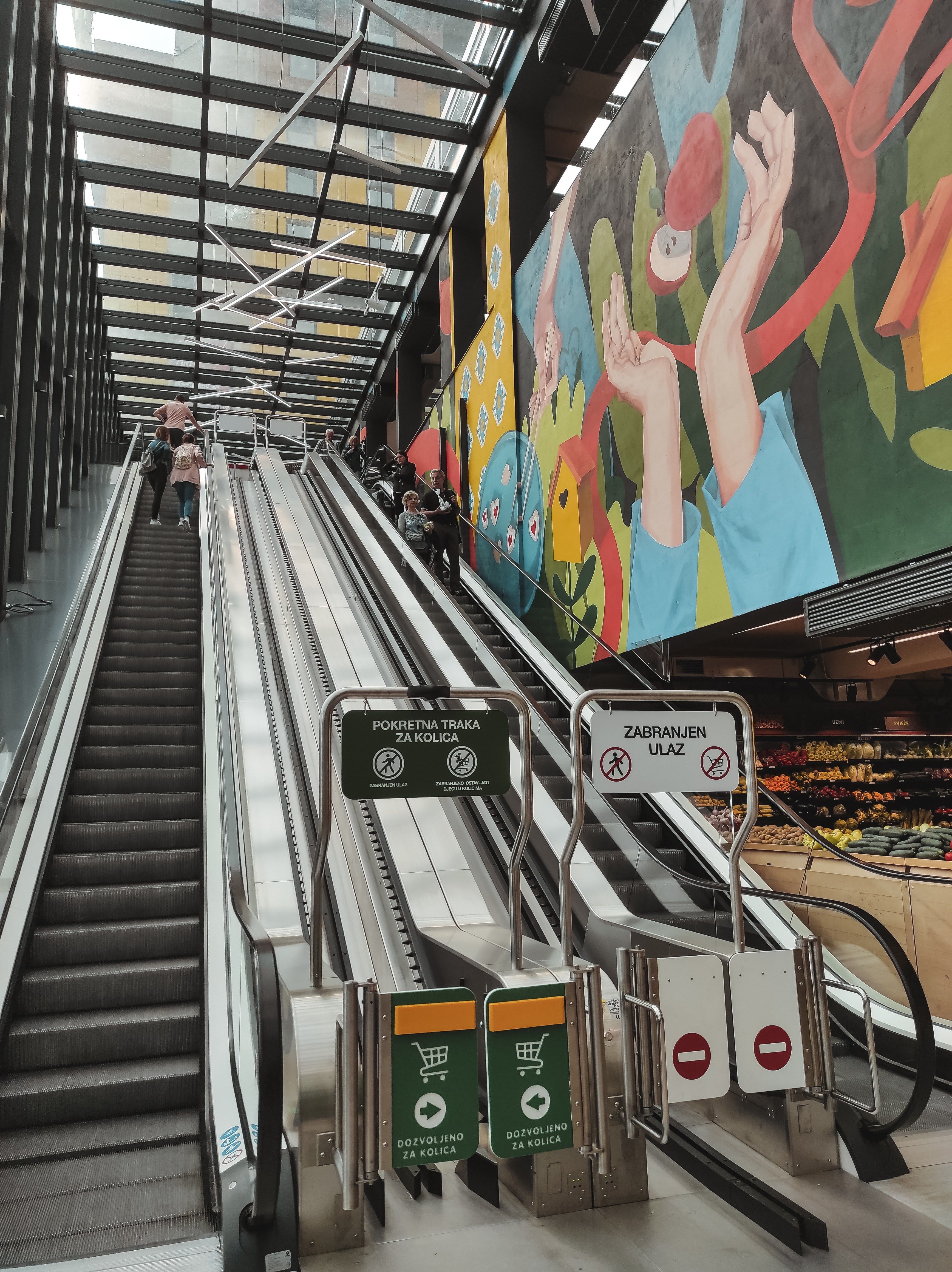 Colorful Indoor Escalator in Modern Shopping Mall · Free Stock Photo