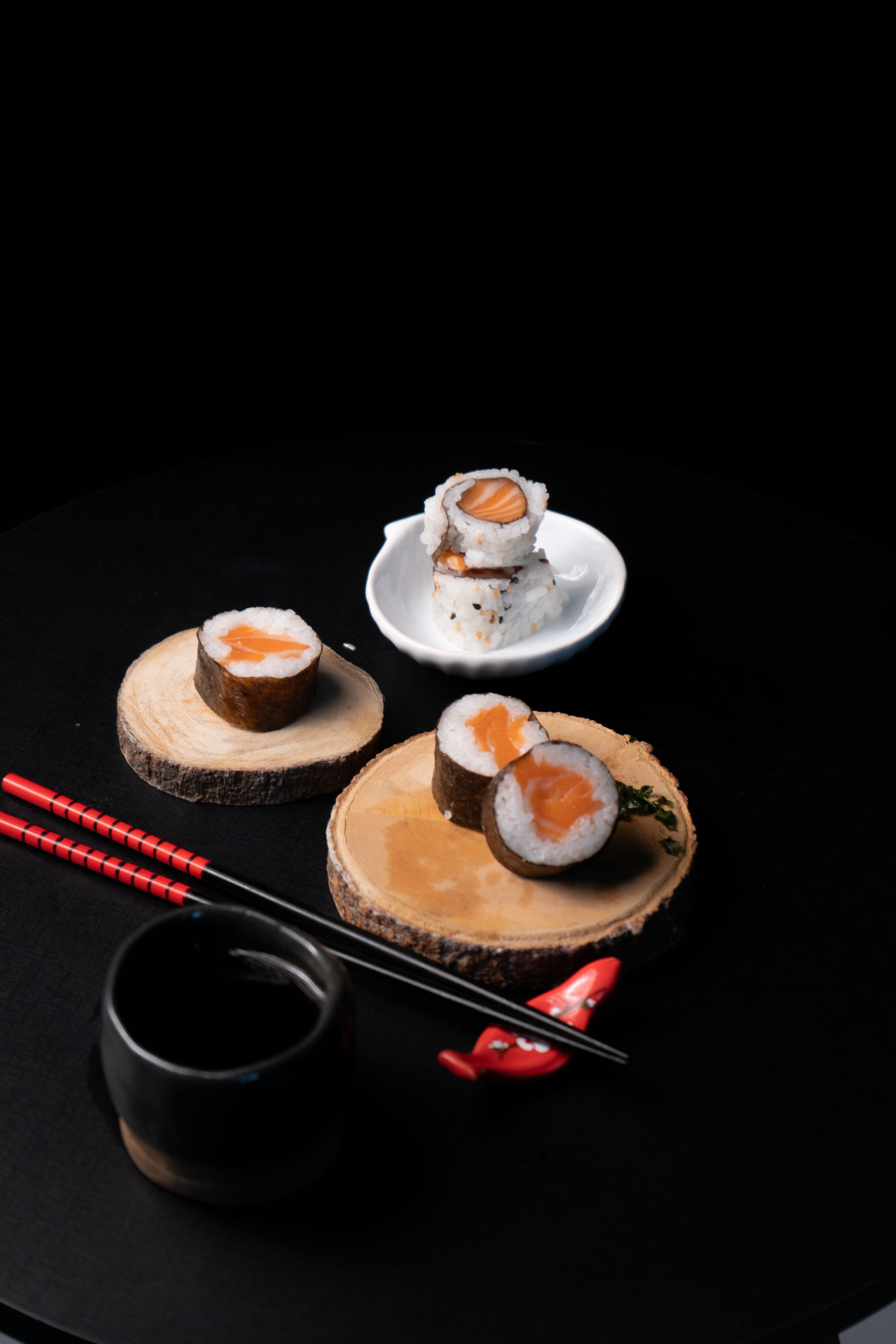 Artistic Sushi Presentation on Wooden Platters · Free Stock Photo