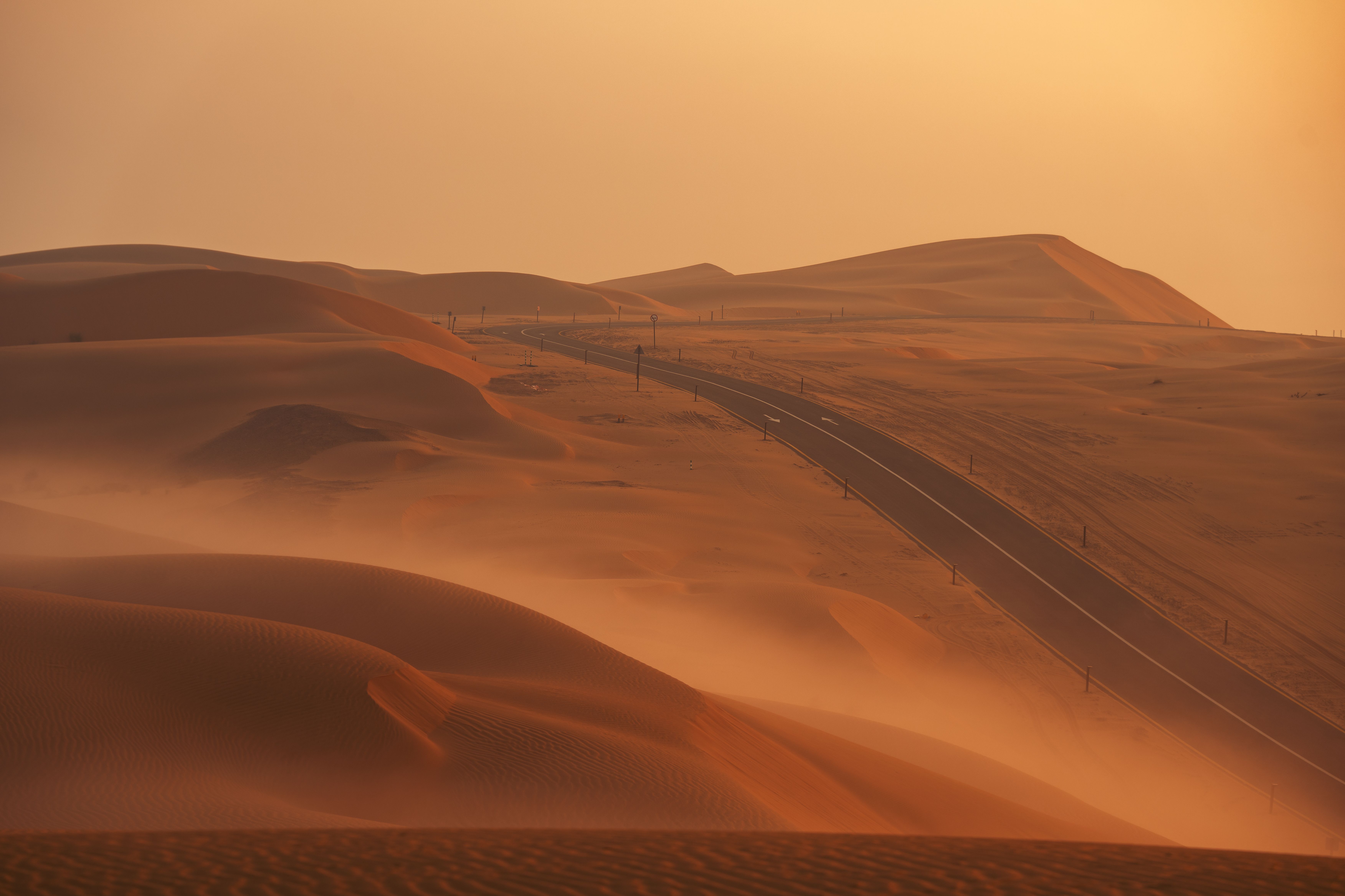 Desert Highway at Sunset with Sand Dunes · Free Stock Photo