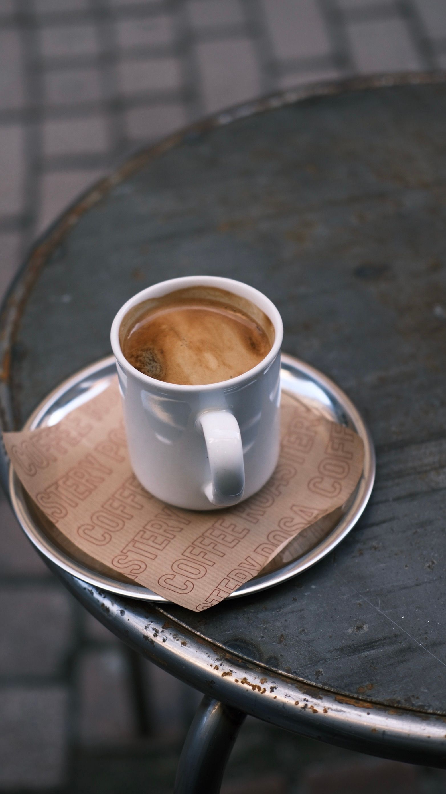 White Coffee Mug on Outdoor Cafe Table · Free Stock Photo