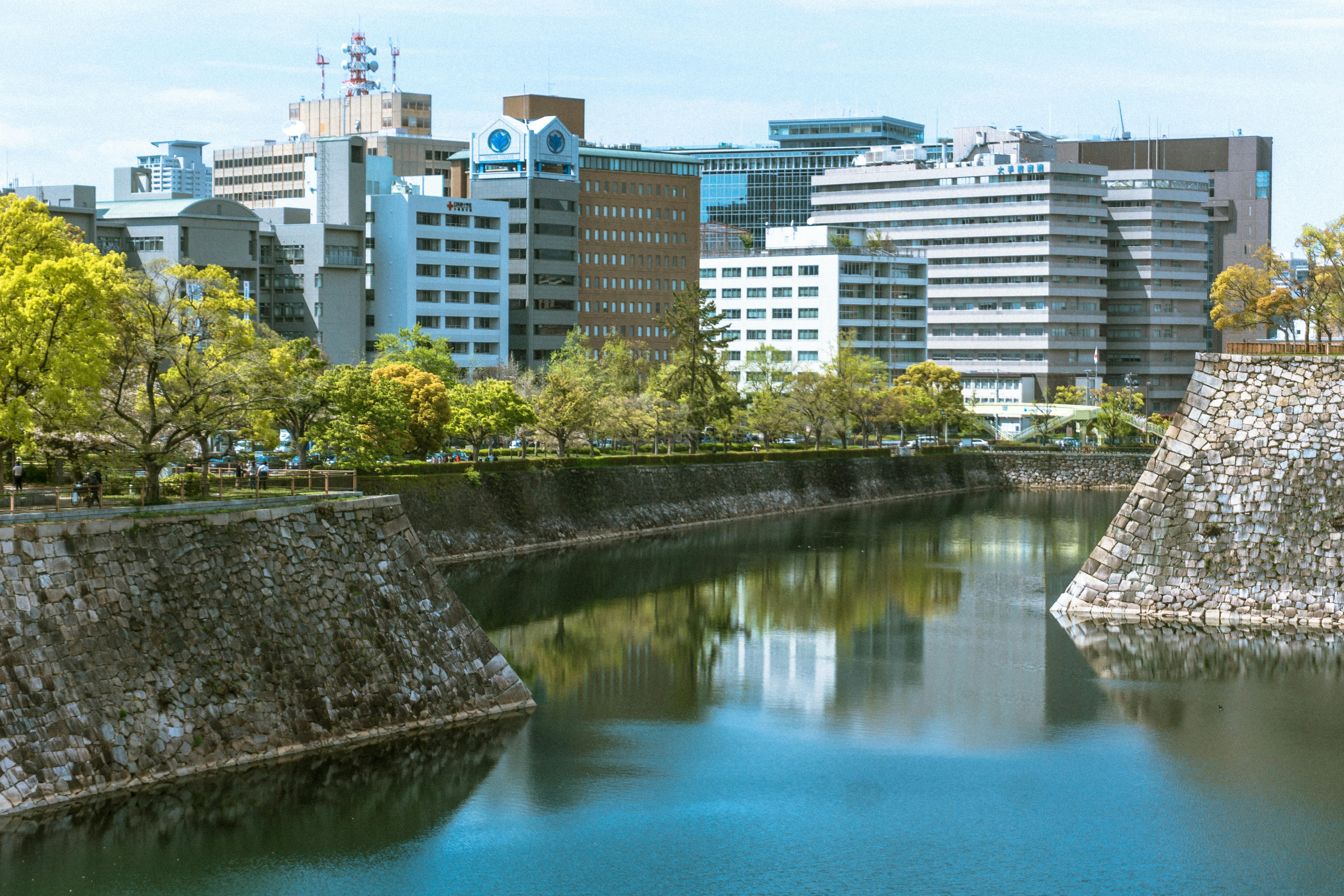 Urban Landscape with Moat and Skyscrapers Reflection · Free Stock Photo