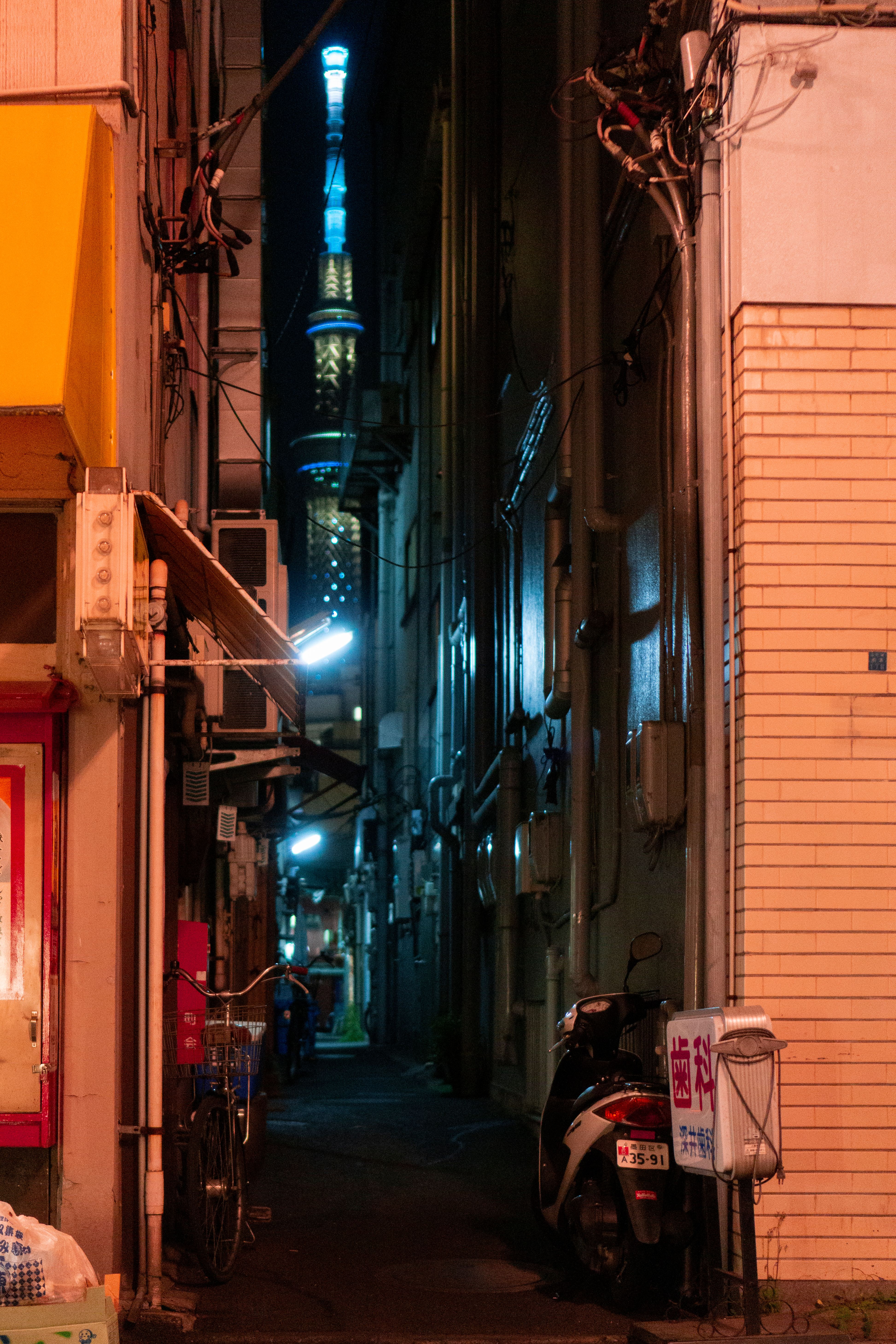 Tokyo Skytree Glimpsed Through Urban Alley at Night · Free Stock Photo