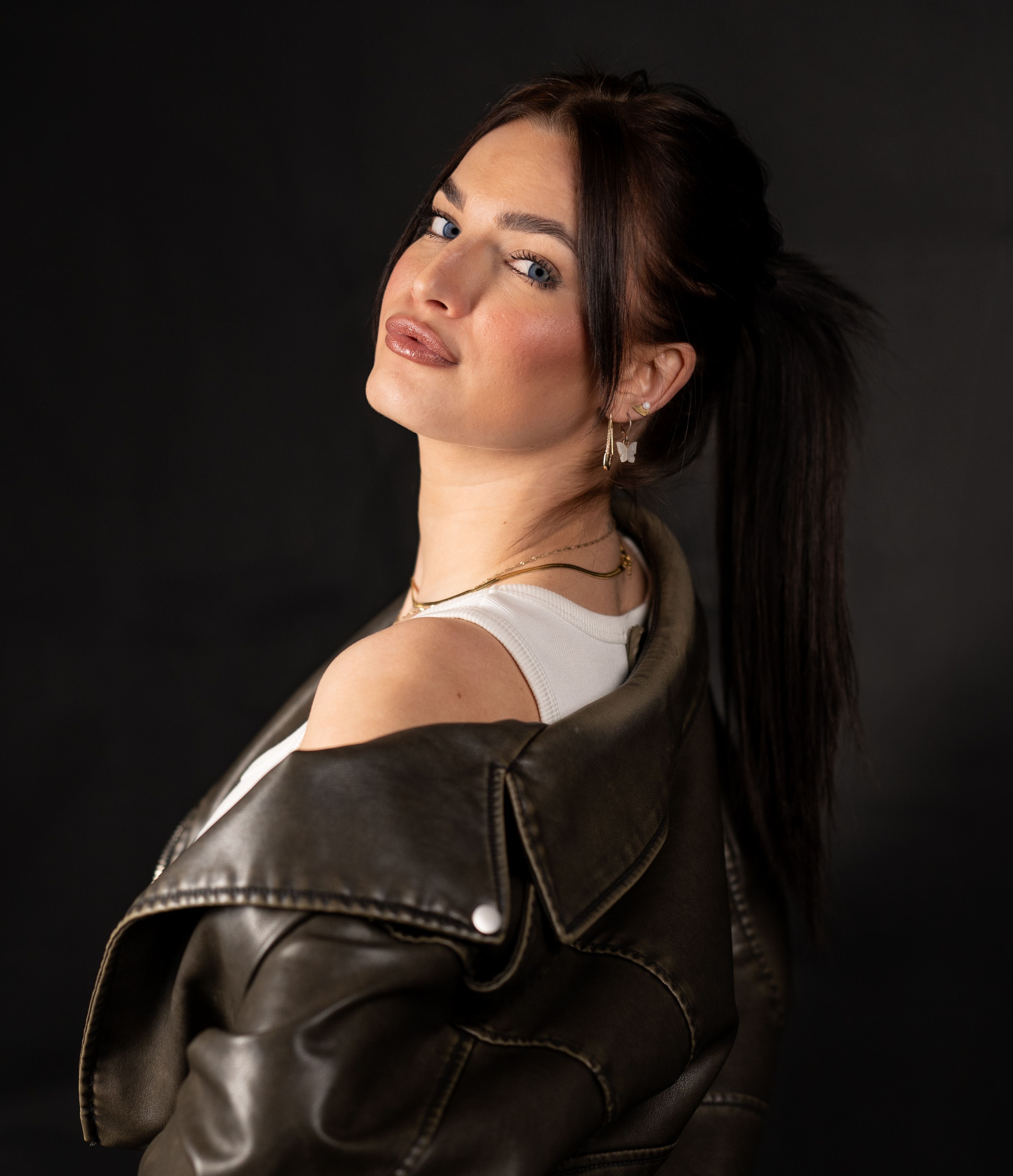 Stylish Woman Posing in Leather Jacket · Free Stock Photo