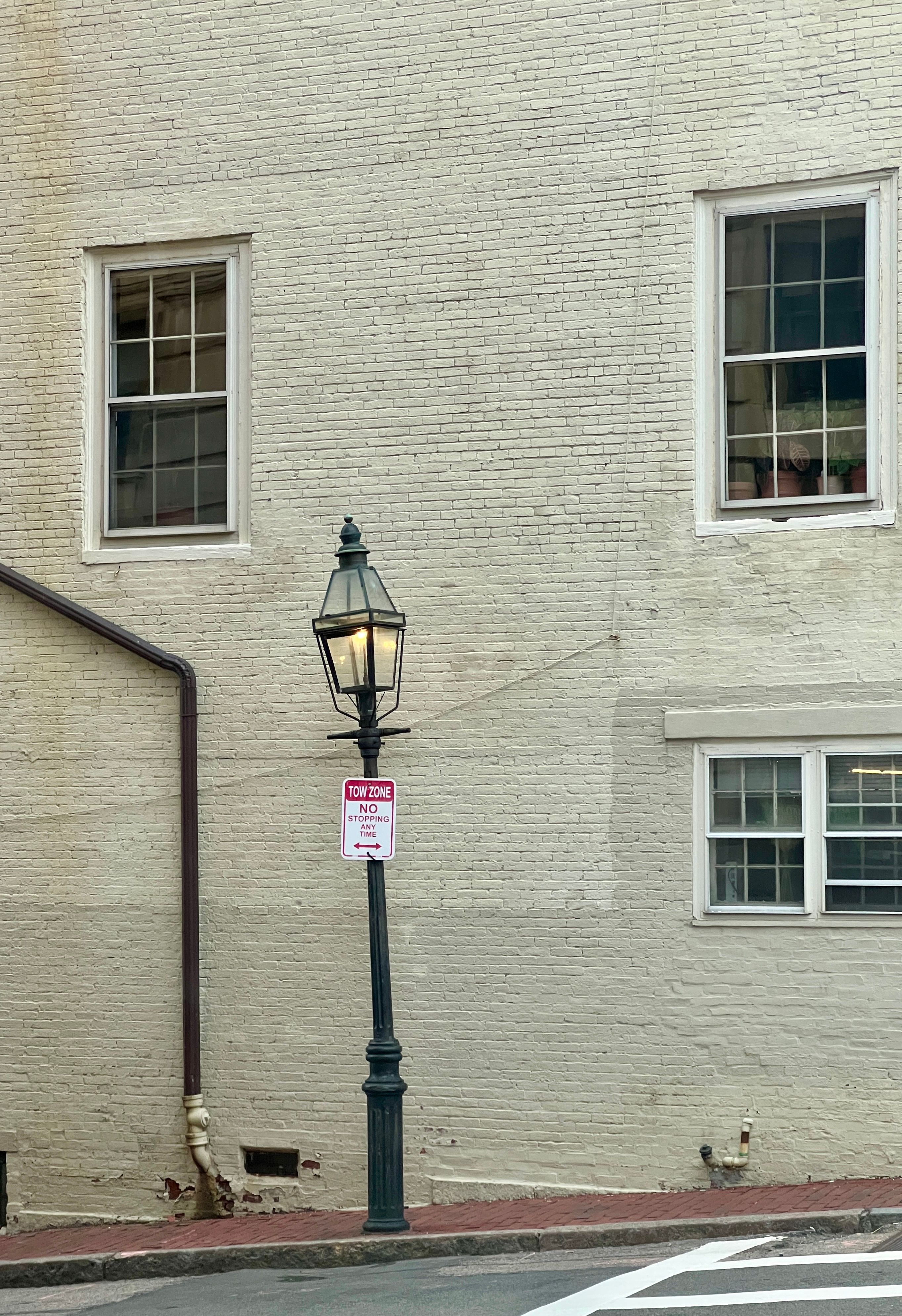 Historic Street Scene with Lamp Post and Brick Wall · Free Stock Photo