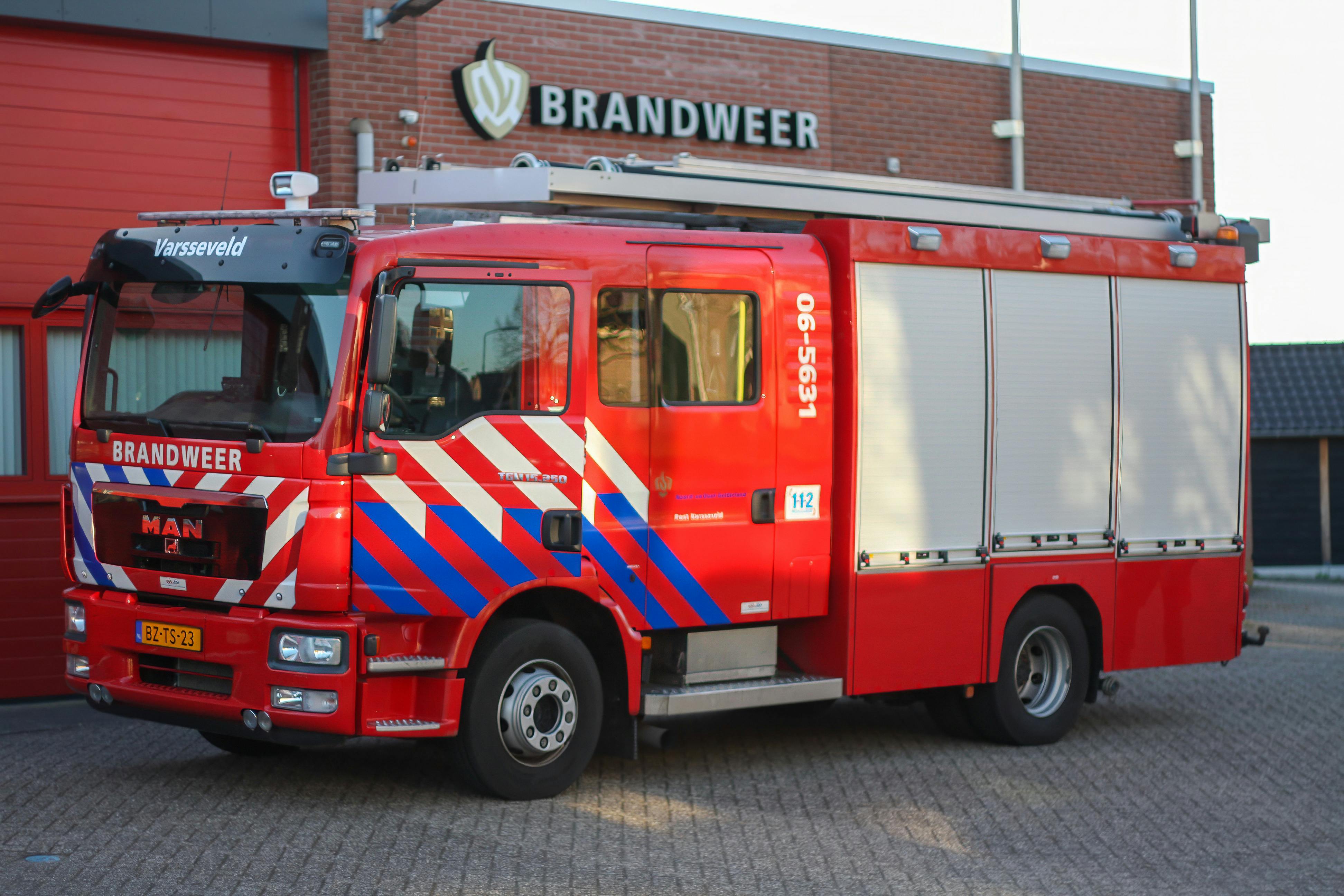 Red Fire Truck in Front of Dutch Fire Station · Free Stock Photo