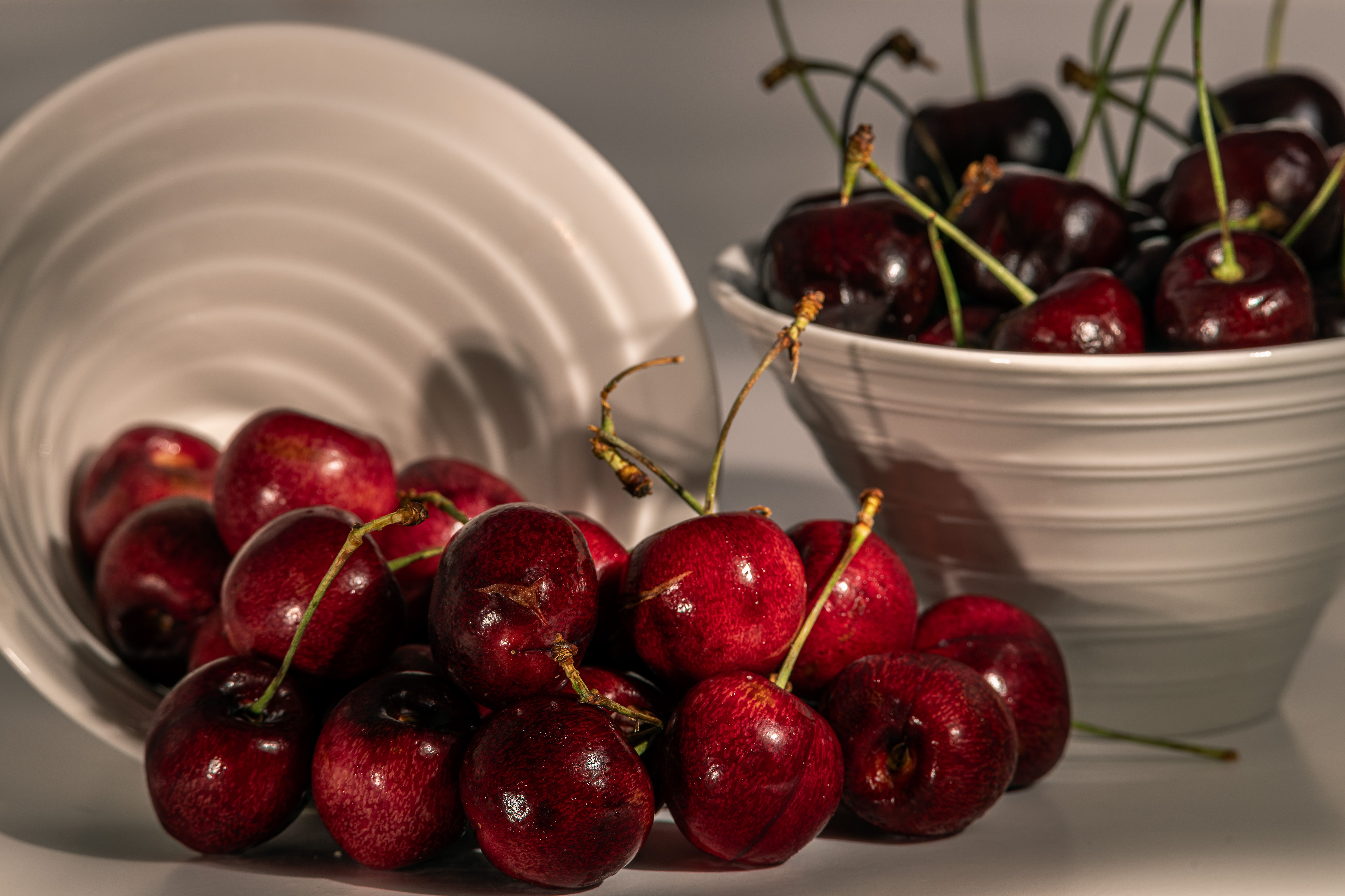 Fresh Red Cherries in White Ceramic Bowls · Free Stock Photo