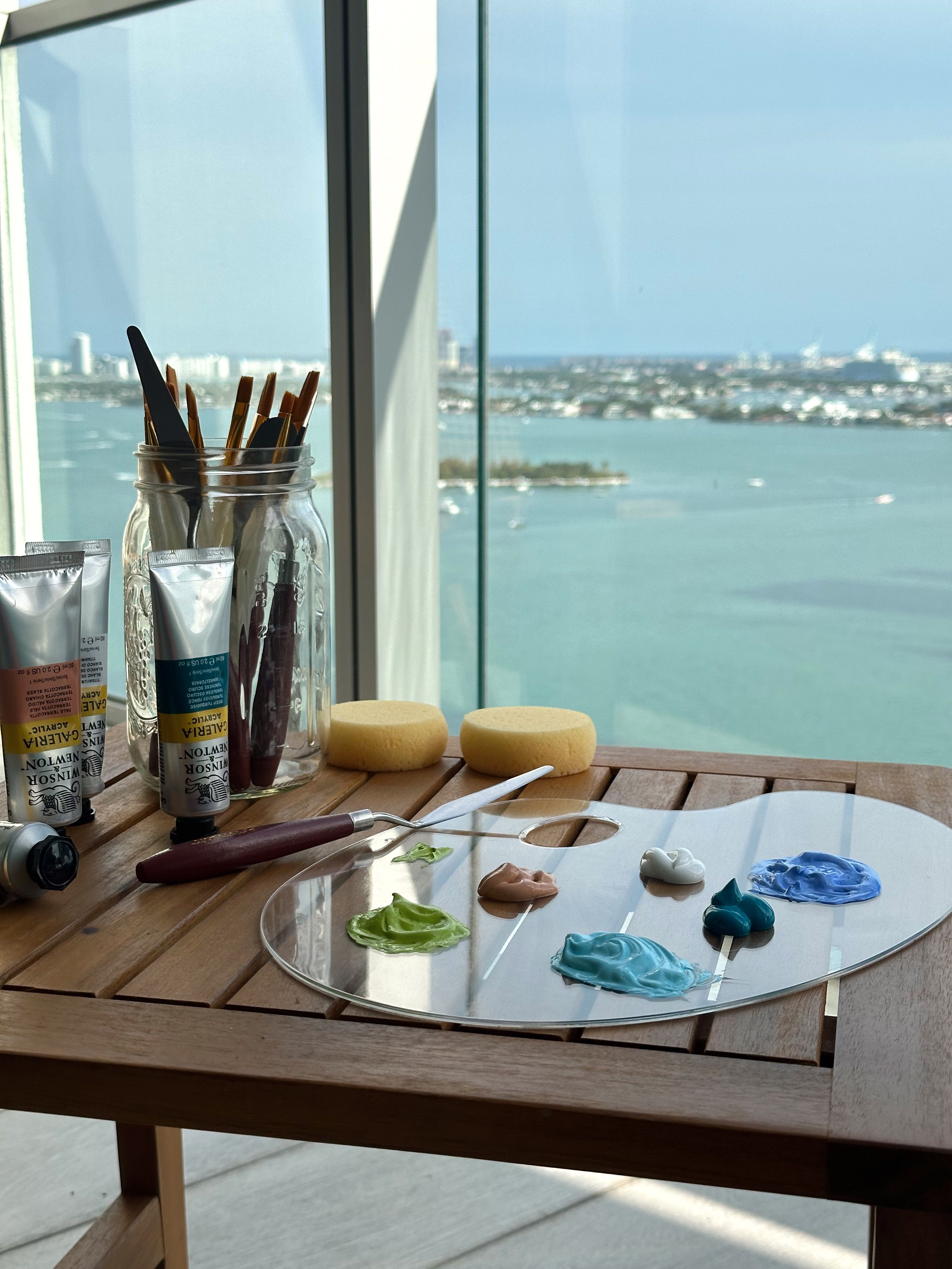 Artistic Workspace with Ocean View for Inspiration · Free Stock Photo