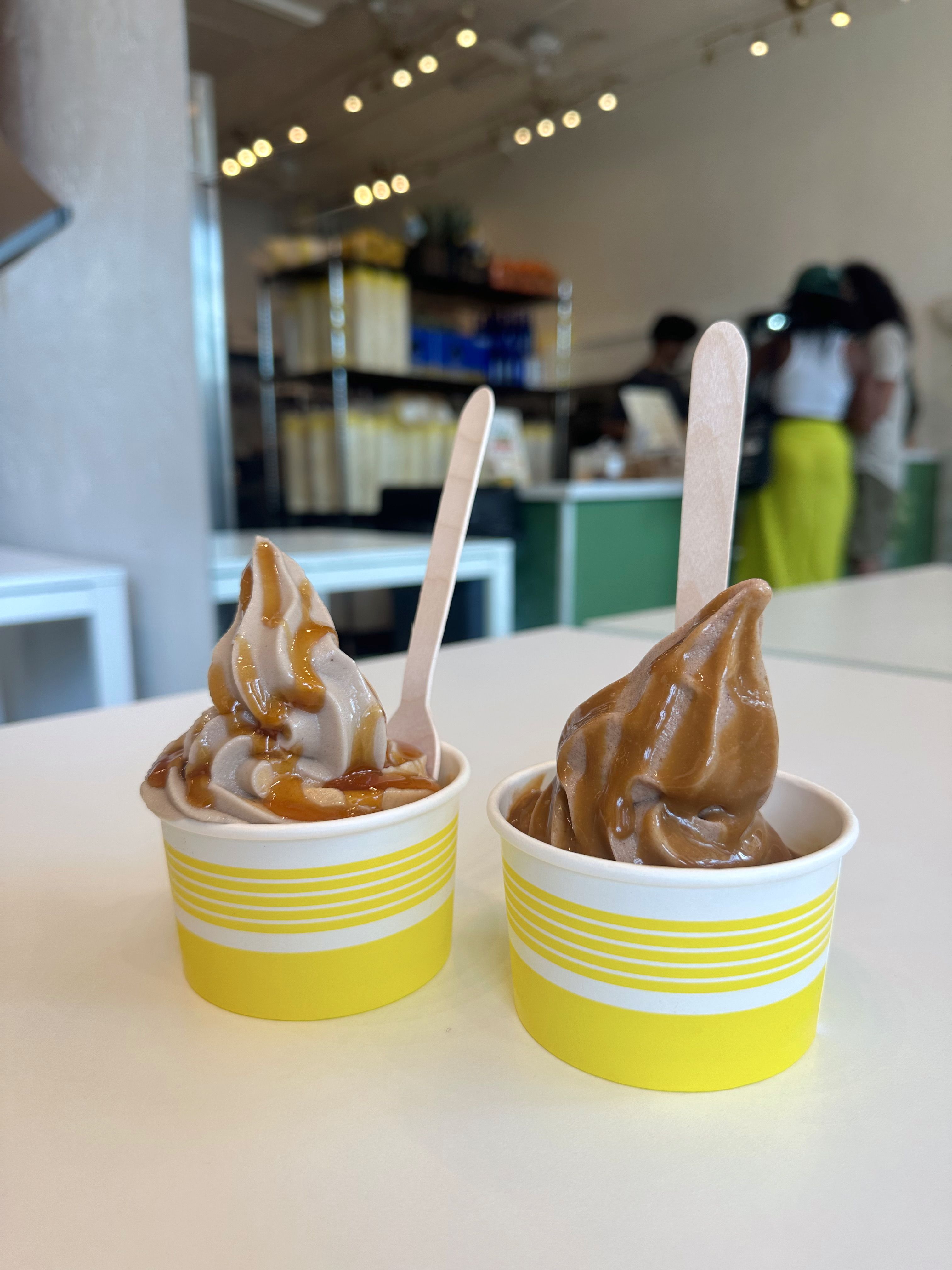 Delicious Soft Serve Ice Cream in Yellow Cups · Free Stock Photo