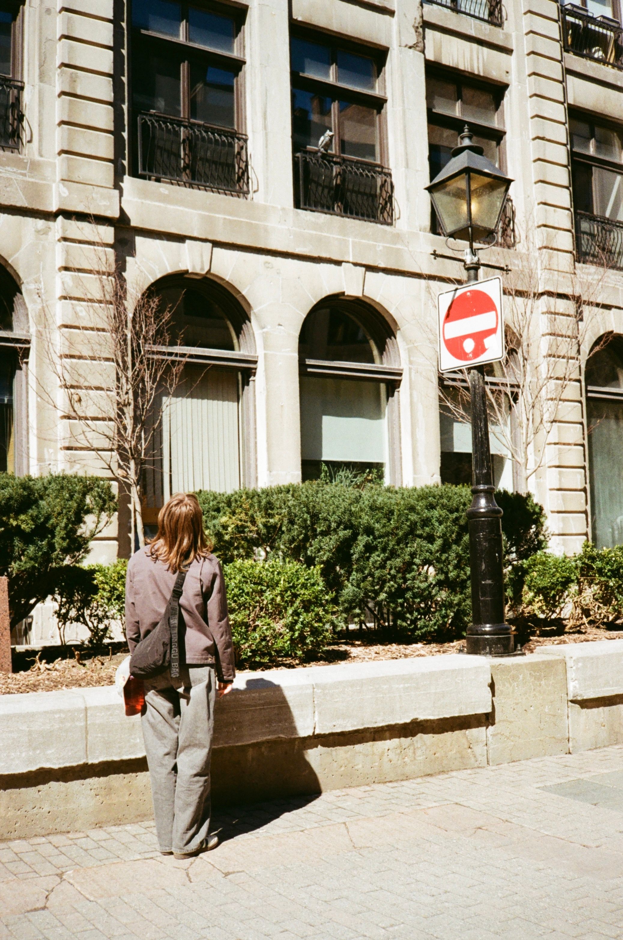 Urban Scene with Person Viewing Building · Free Stock Photo
