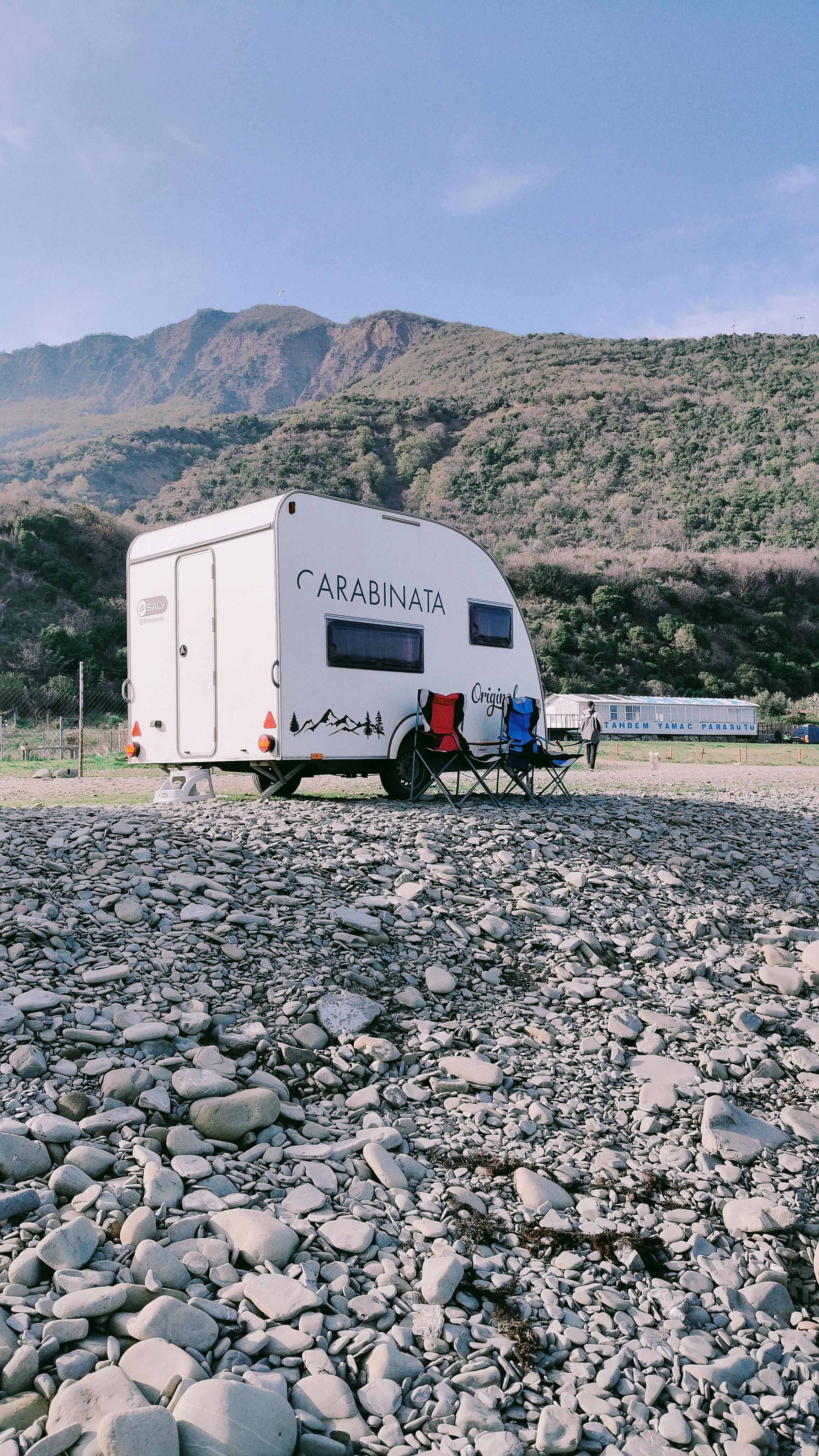 Cozy Caravan Amidst Scenic Mountain Landscape · Free Stock Photo