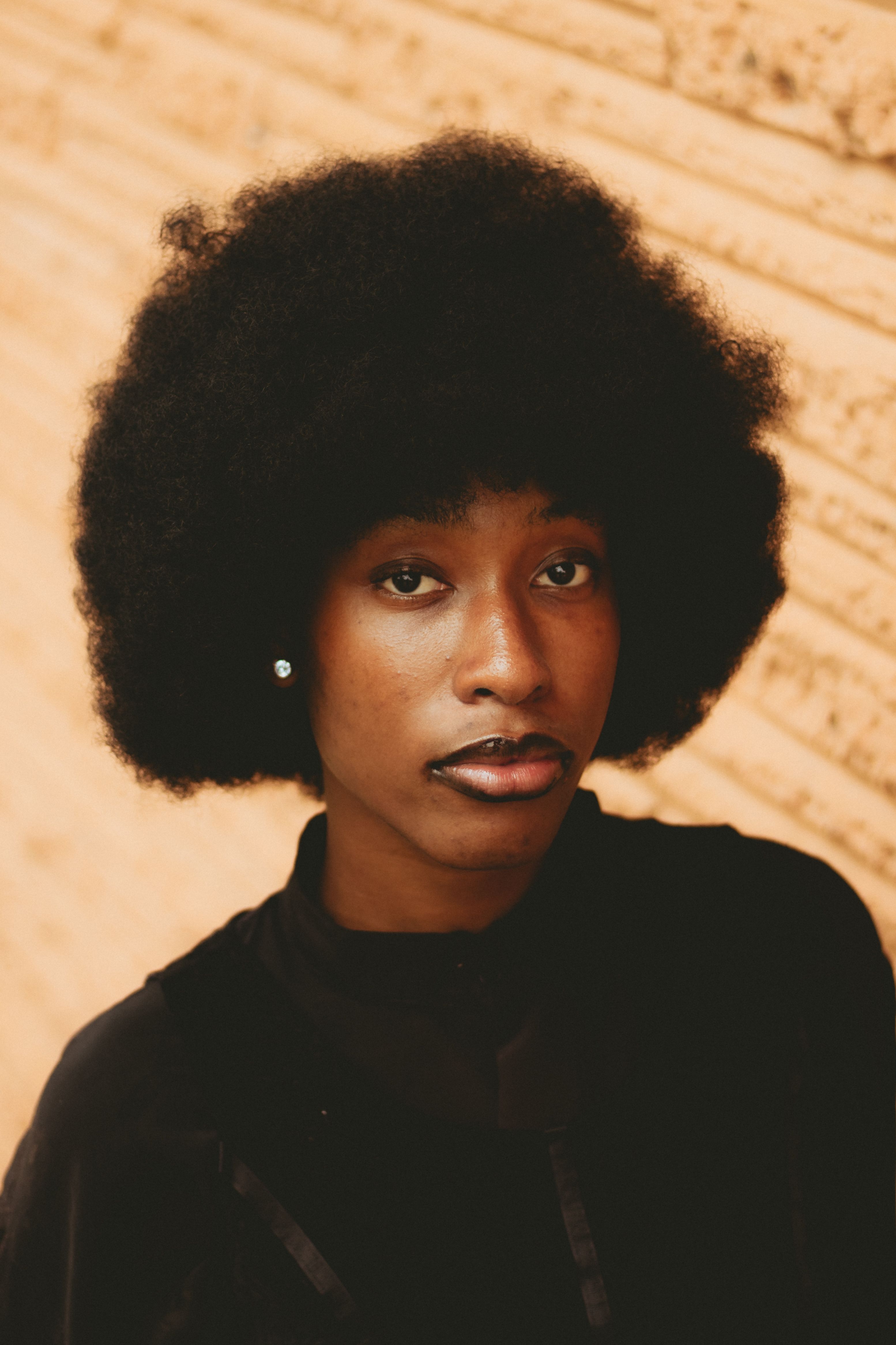 Portrait of a Person with Afro Hairstyle Outdoors · Free Stock Photo