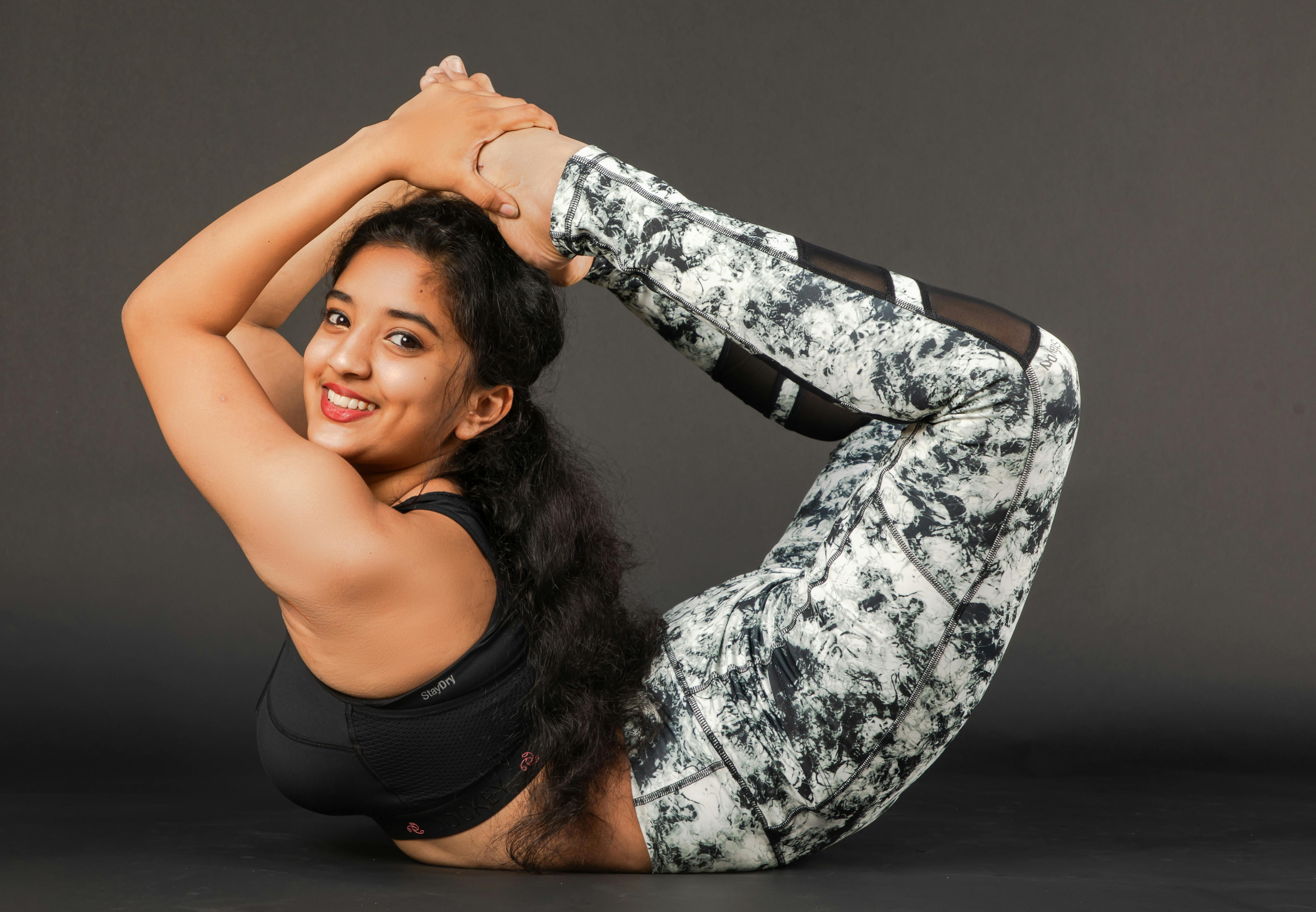 Yoga Practitioner in Advanced Pose Indoors · Free Stock Photo