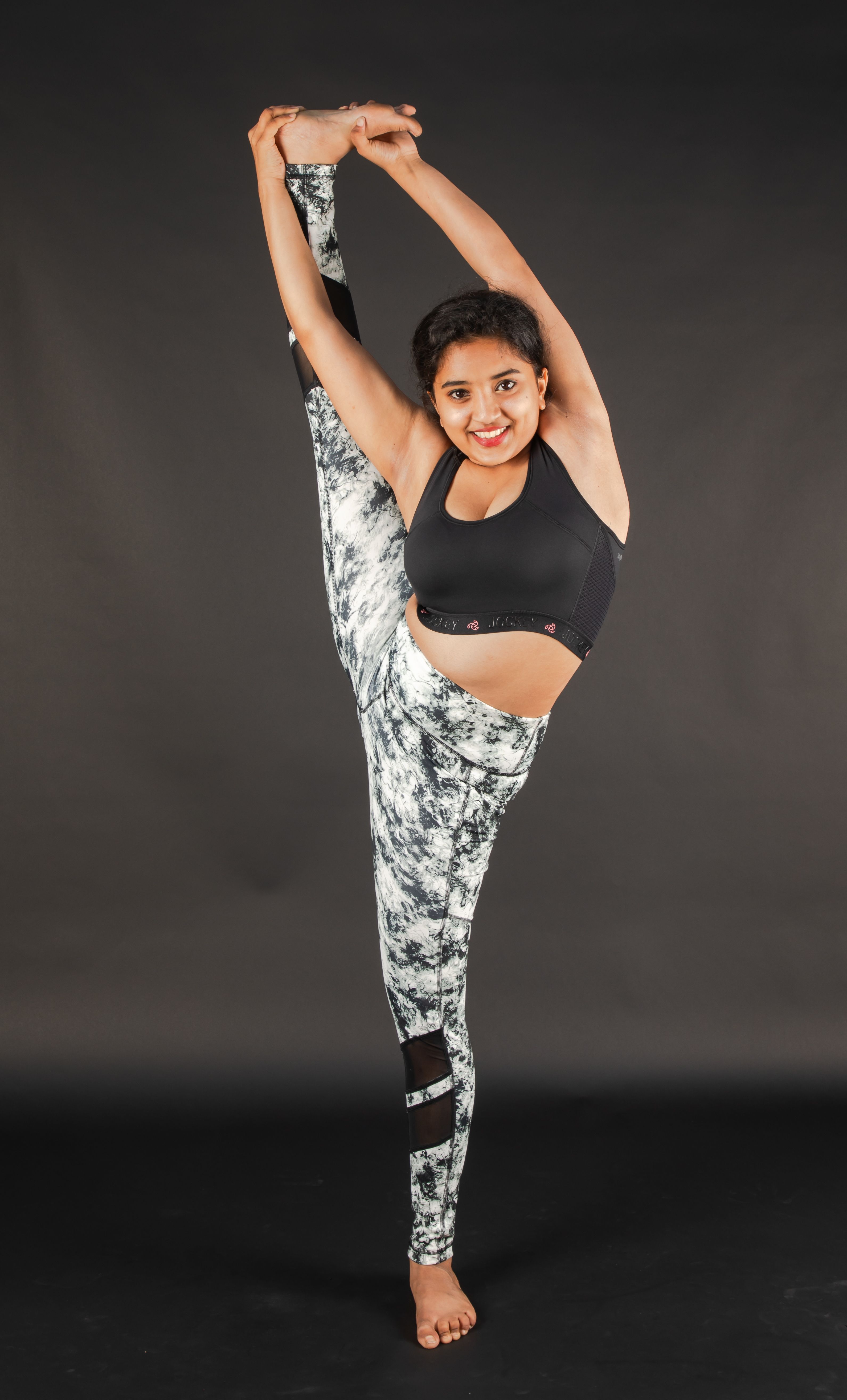 Dynamic Yoga Pose on Black Background · Free Stock Photo